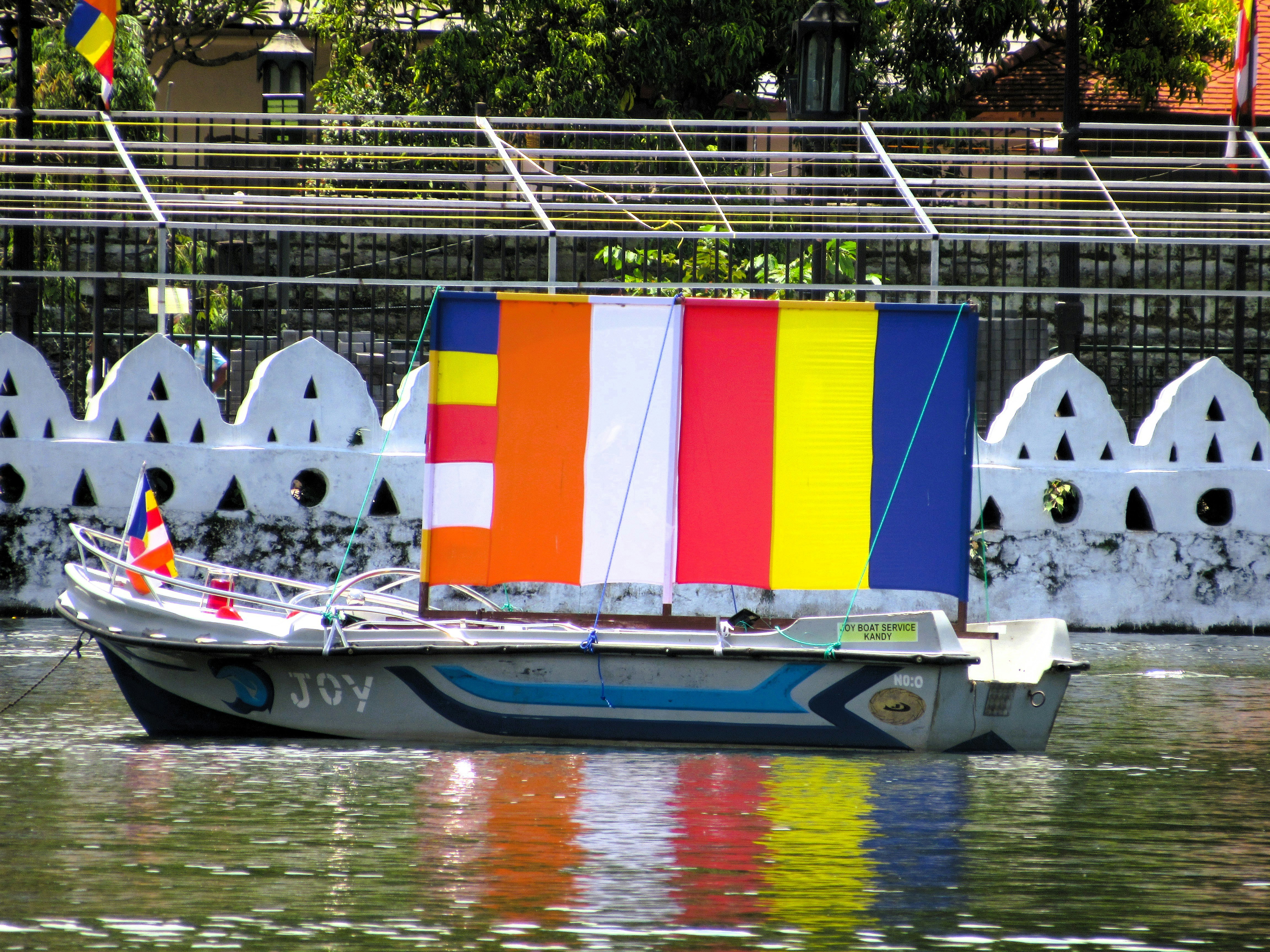 Joy Under Prism Sail on a Riverside Channel