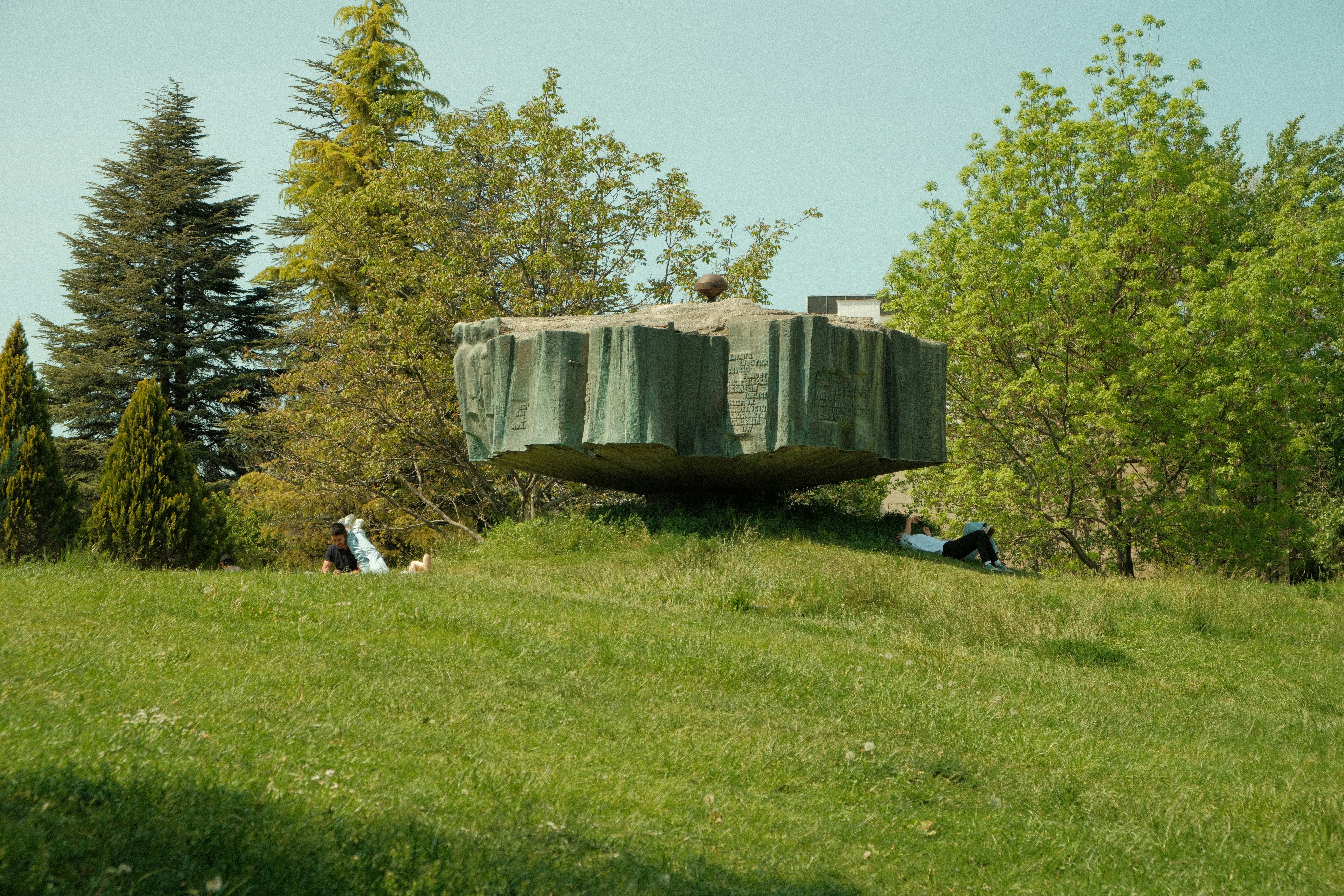 Hovering Granite Monolith over a Sunlit Park