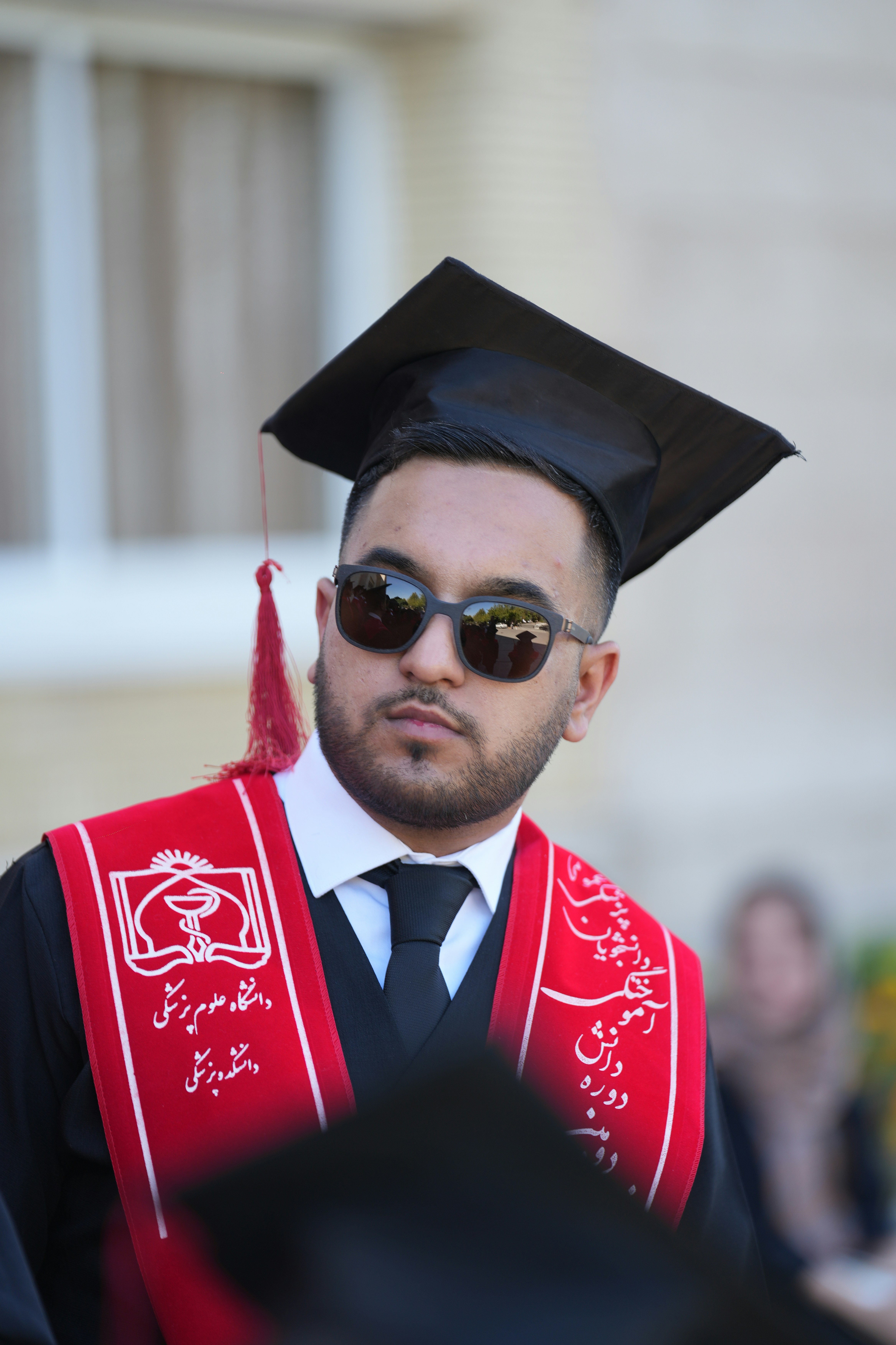 A graduate is posing in his graduation attire. photo – Free Portrait ...