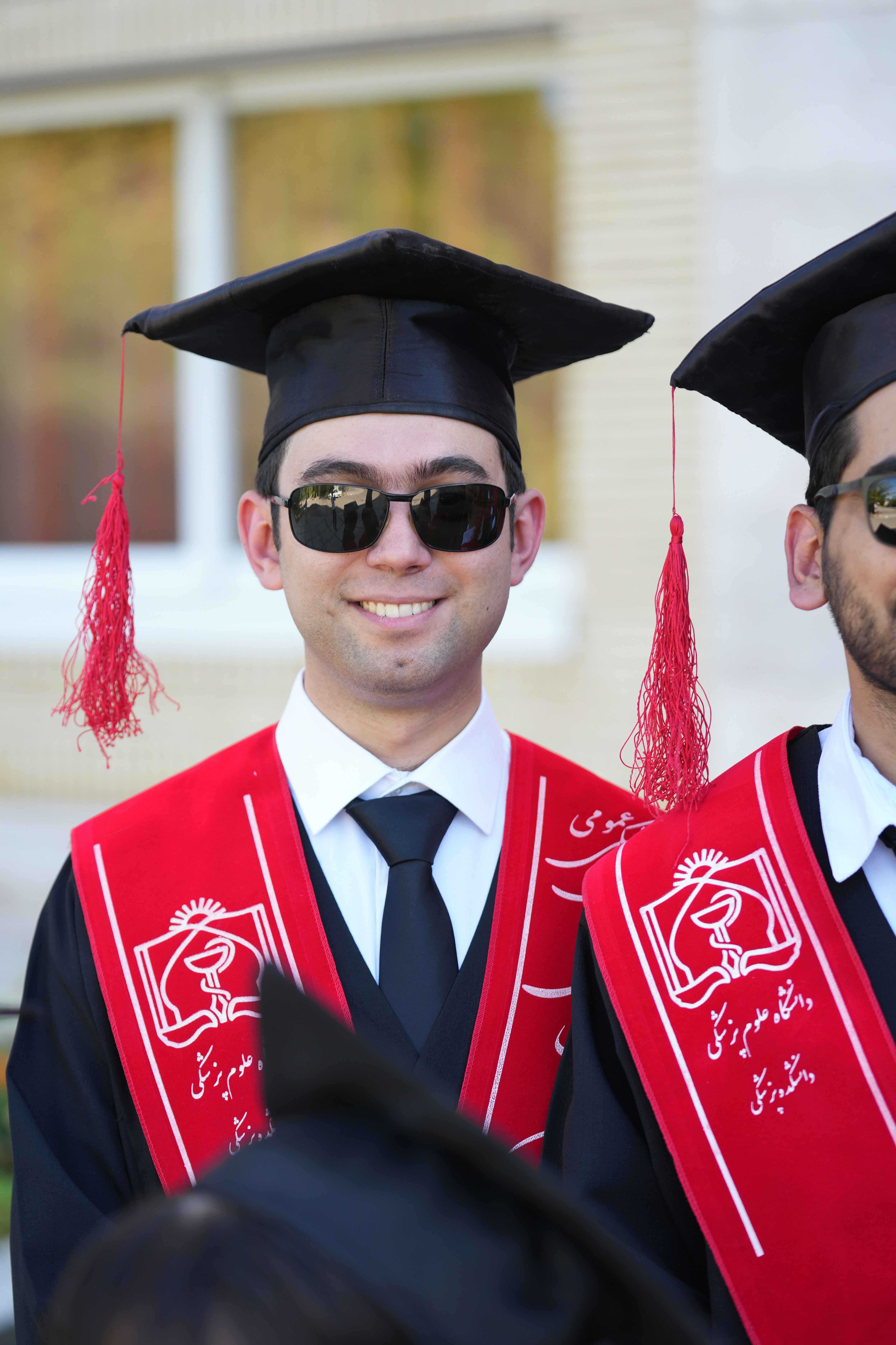 A graduate poses with a smile on graduation day. photo – Free Portrait ...