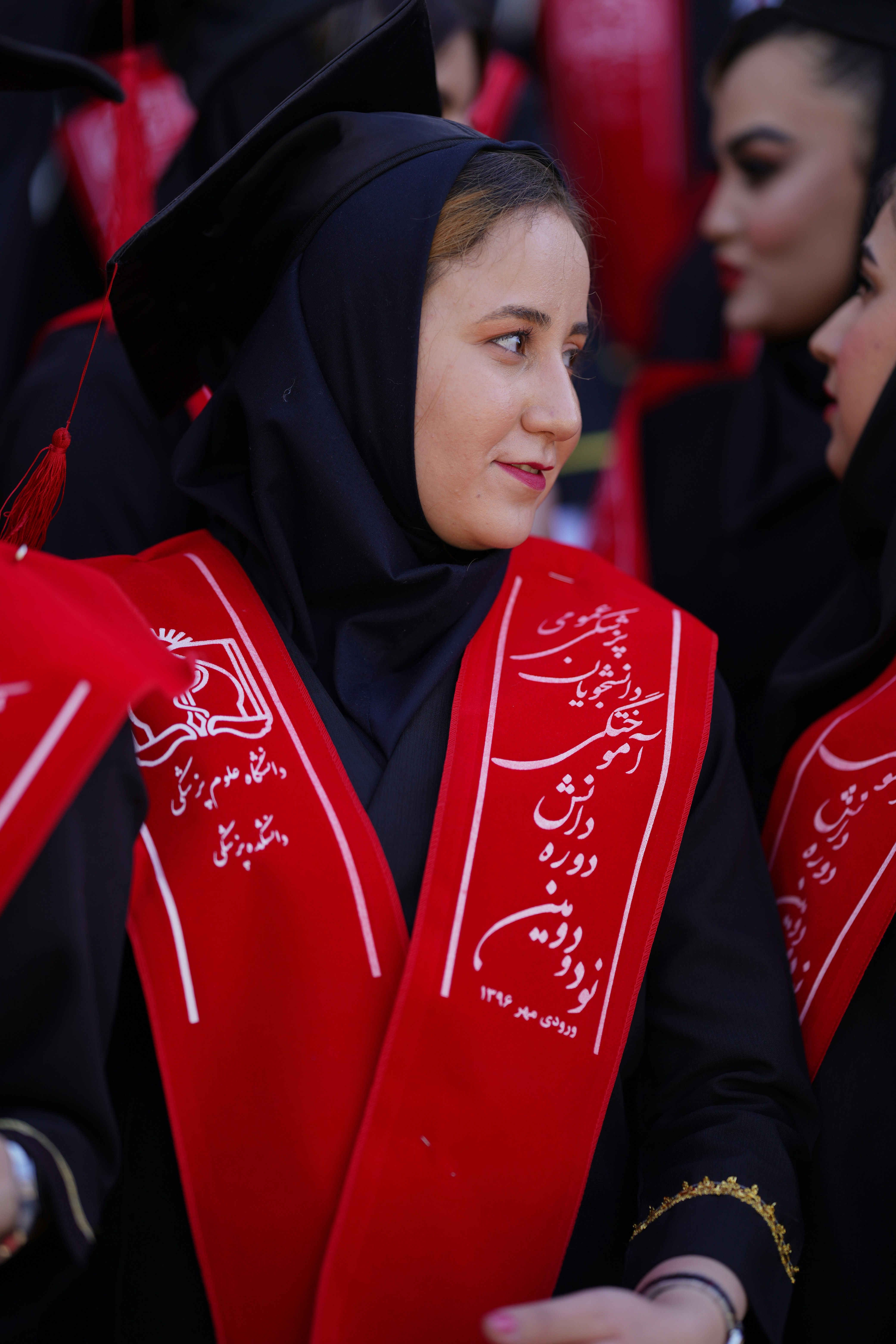 A woman celebrates graduation day in formal attire. photo – Free Woman ...