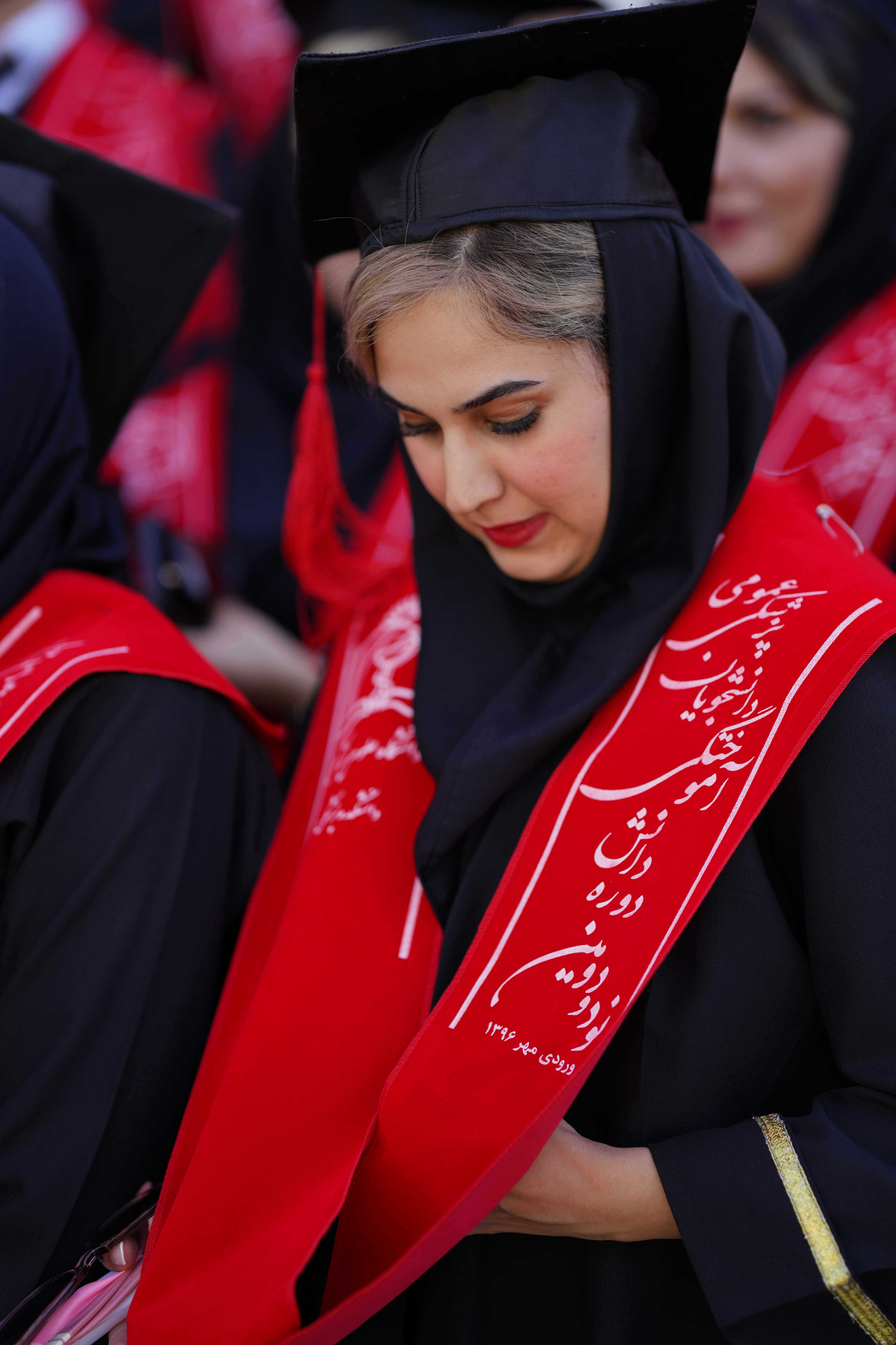 Crimson Sash, Quiet Focus: A Graduate in Reflection