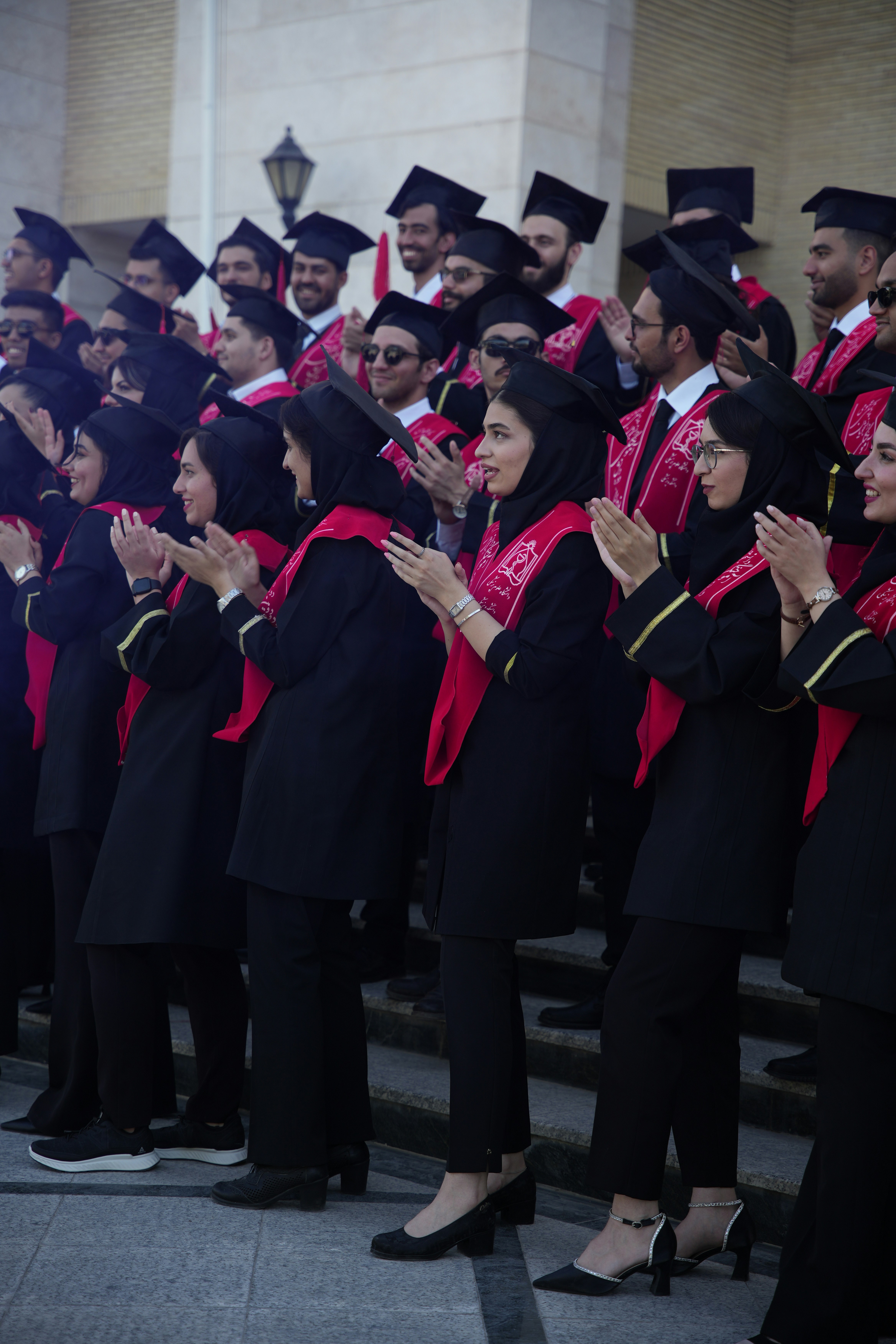 Graduates celebrate their success at a graduation ceremony. photo ...