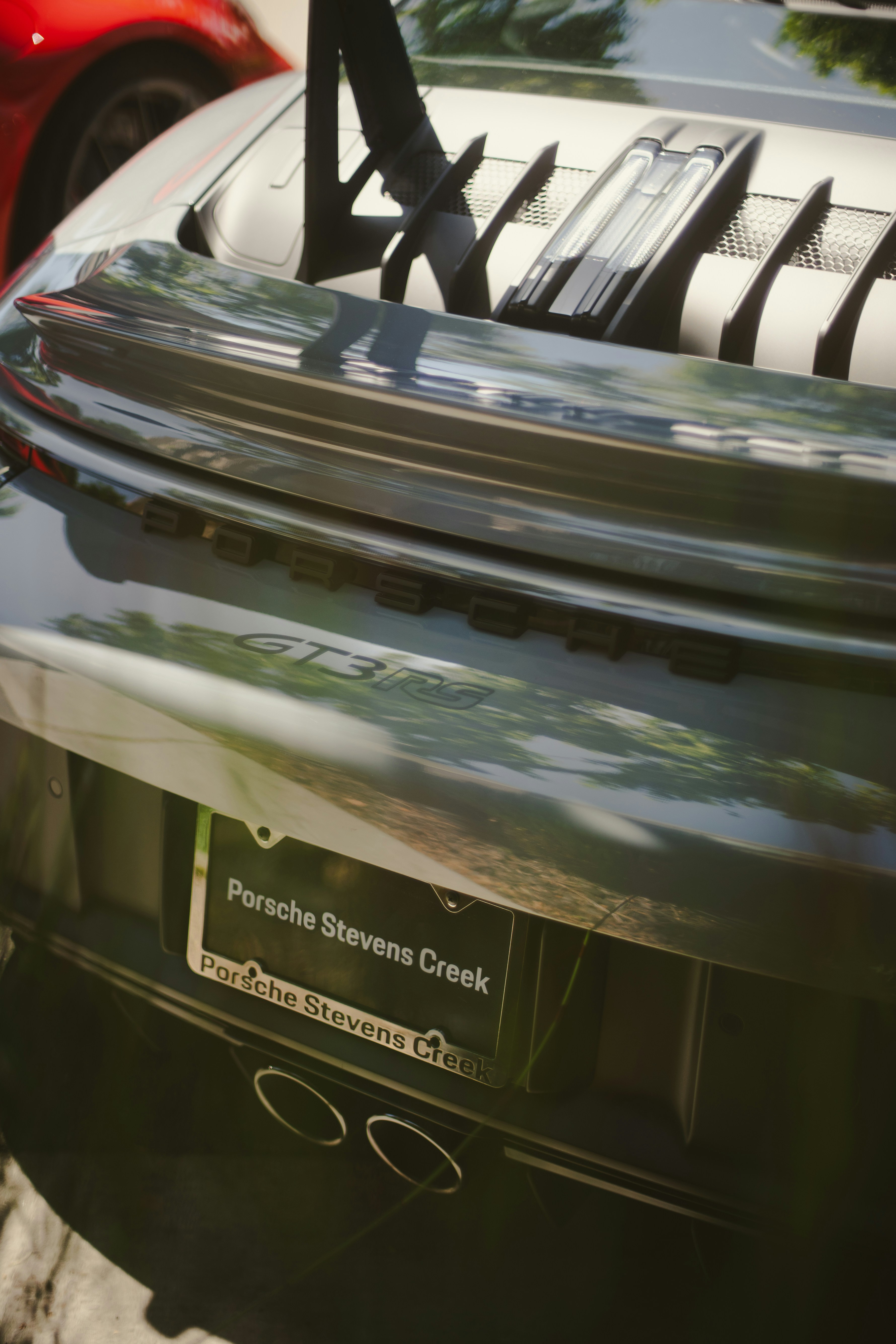 Chrome Echoes: Porsche GT3 RS Rear in a Sunlit Reflection