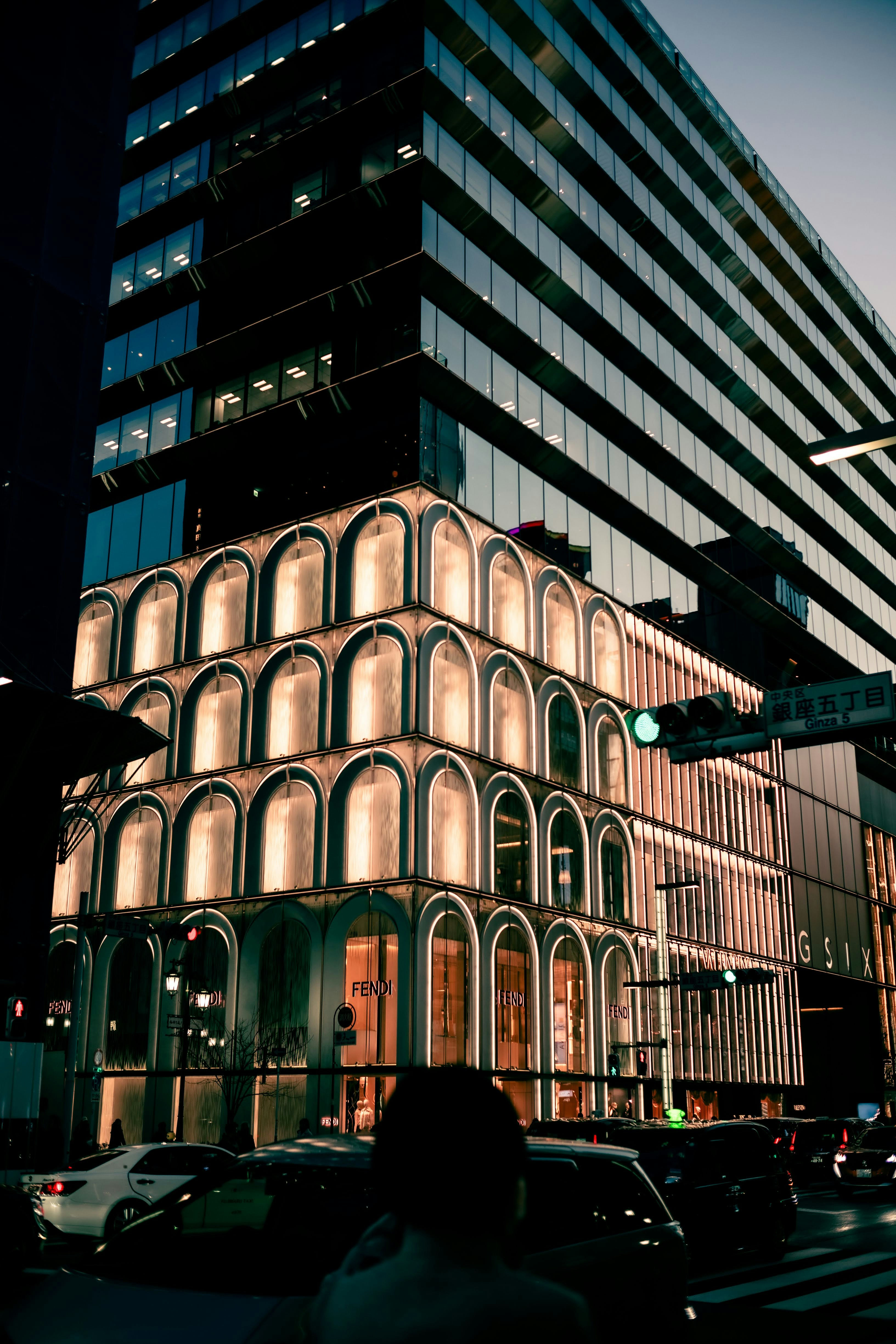 Neon Arches and Glass Skyscraper: A Street-Level Portrait of Urban Geometry
