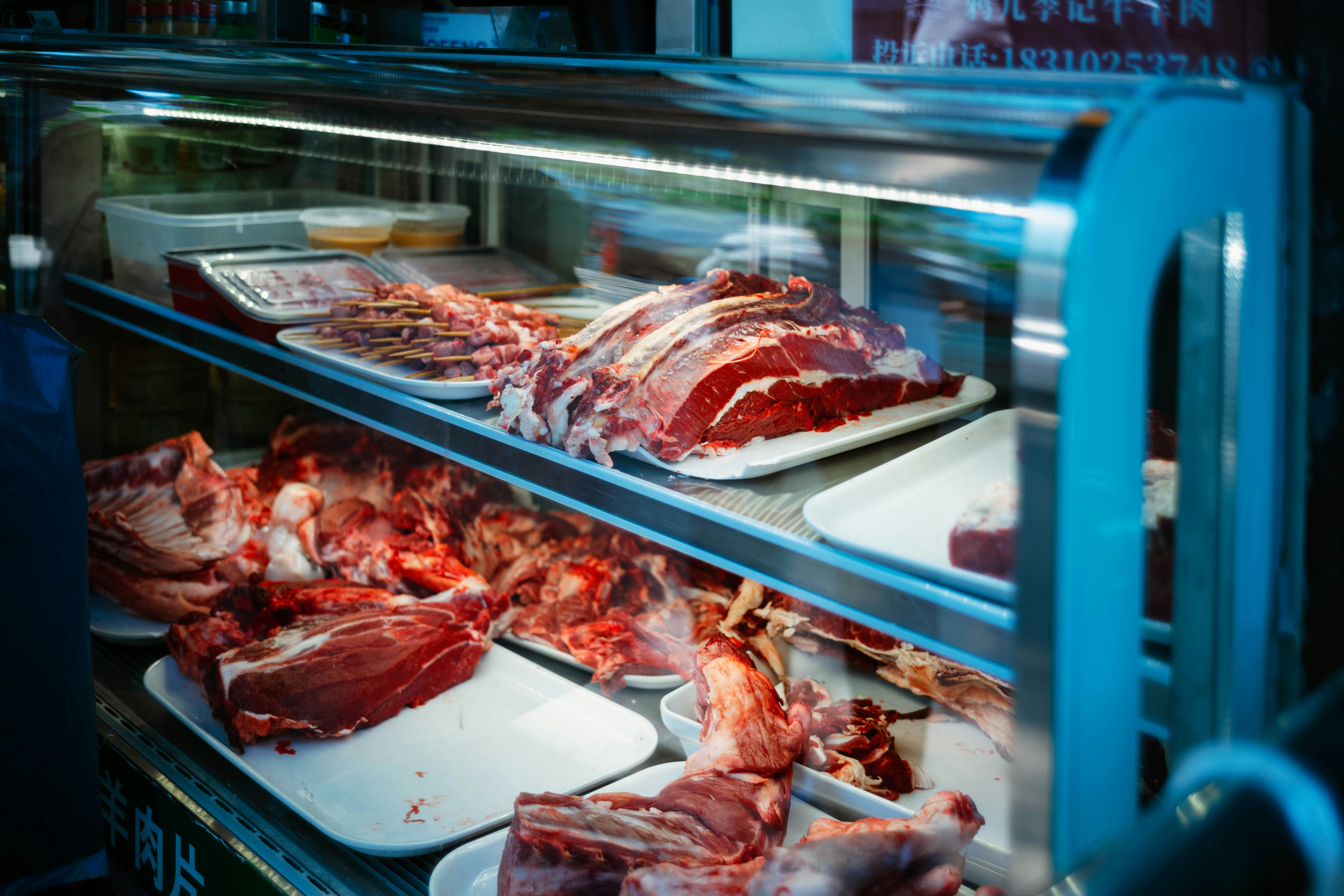 Fresh meat is displayed in a butcher shop. photo – Free Car Image on ...