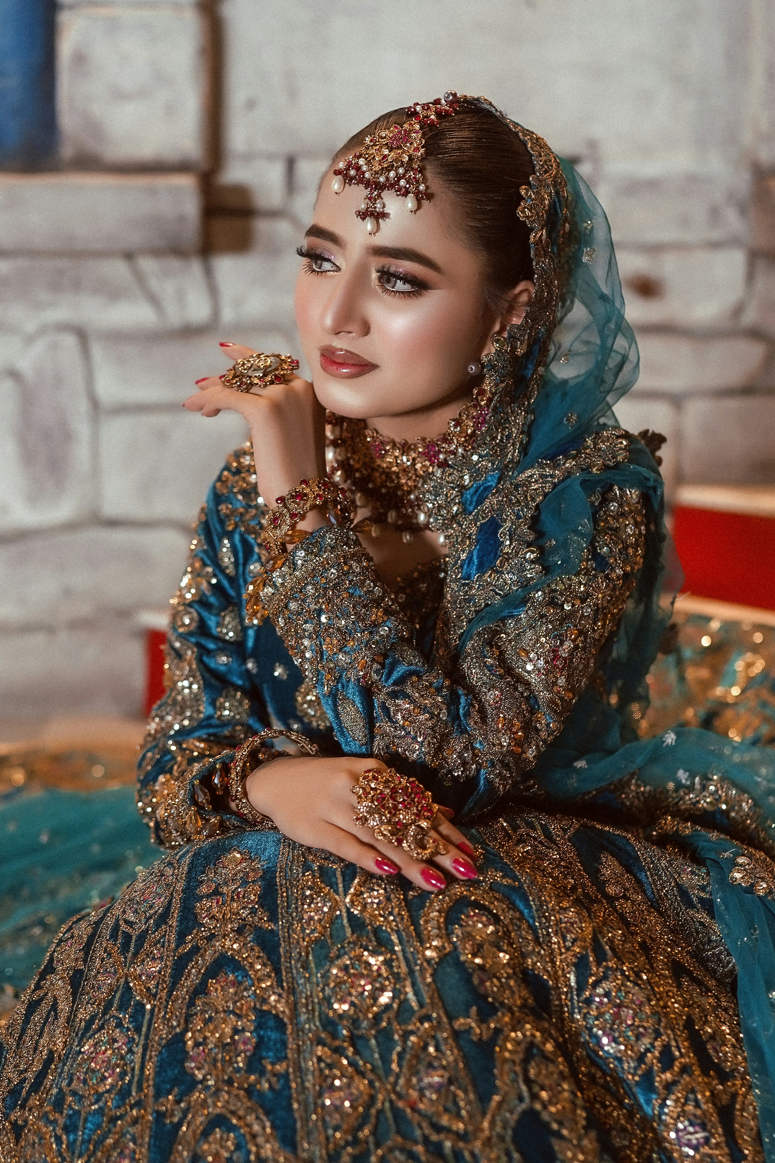 A beautiful bride poses in elaborate wedding attire. photo – Free ...