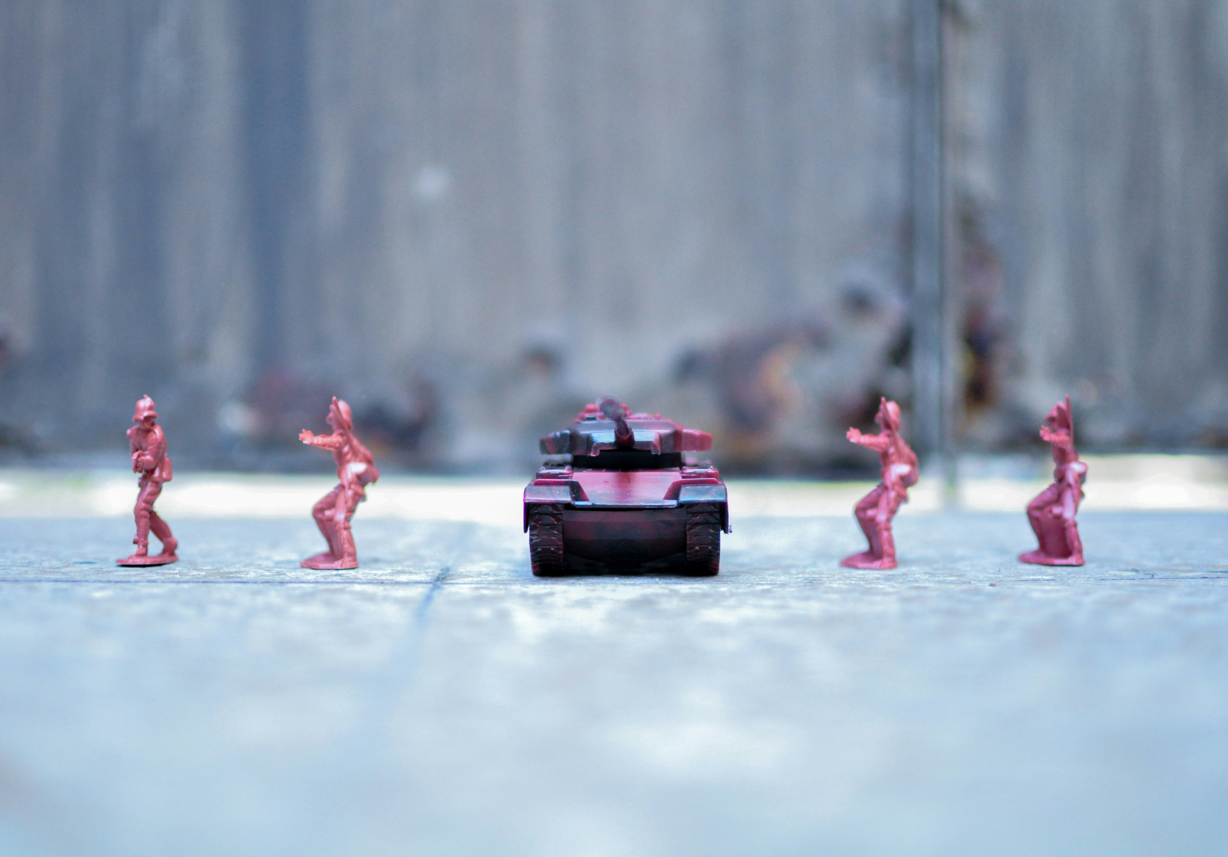 Tabletop Frontline: Centered Red Tank Amid Pink Troops