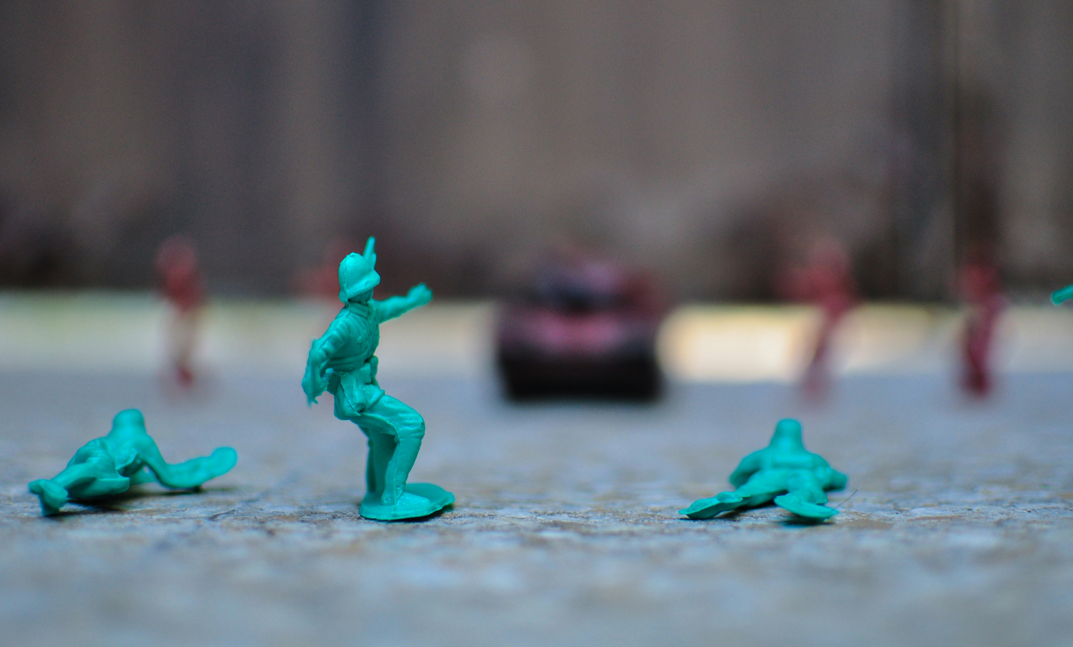 Toy soldiers appear in a battle formation.