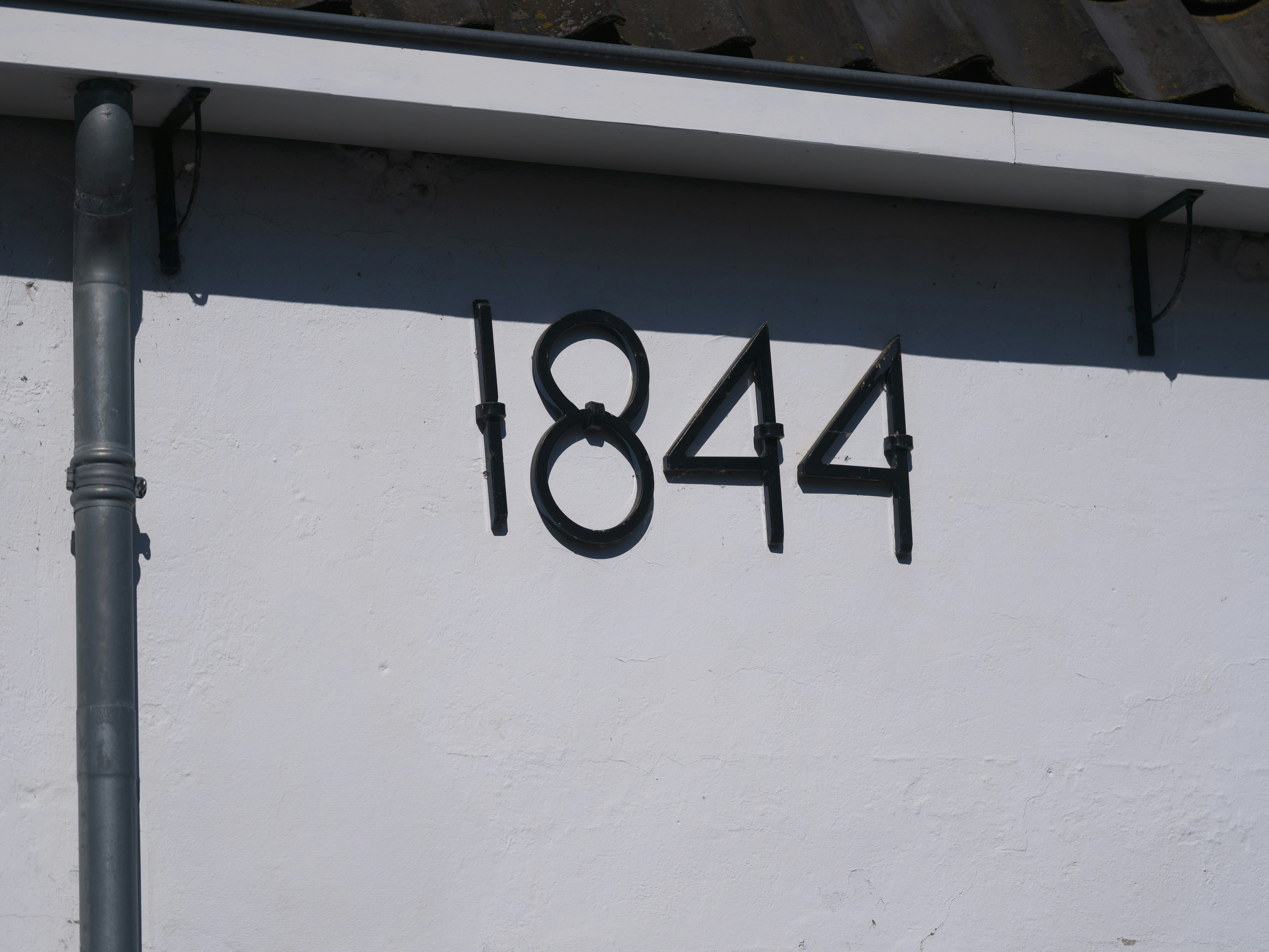 The number 1844 is displayed on a wall. photo – Free Texture Image on ...