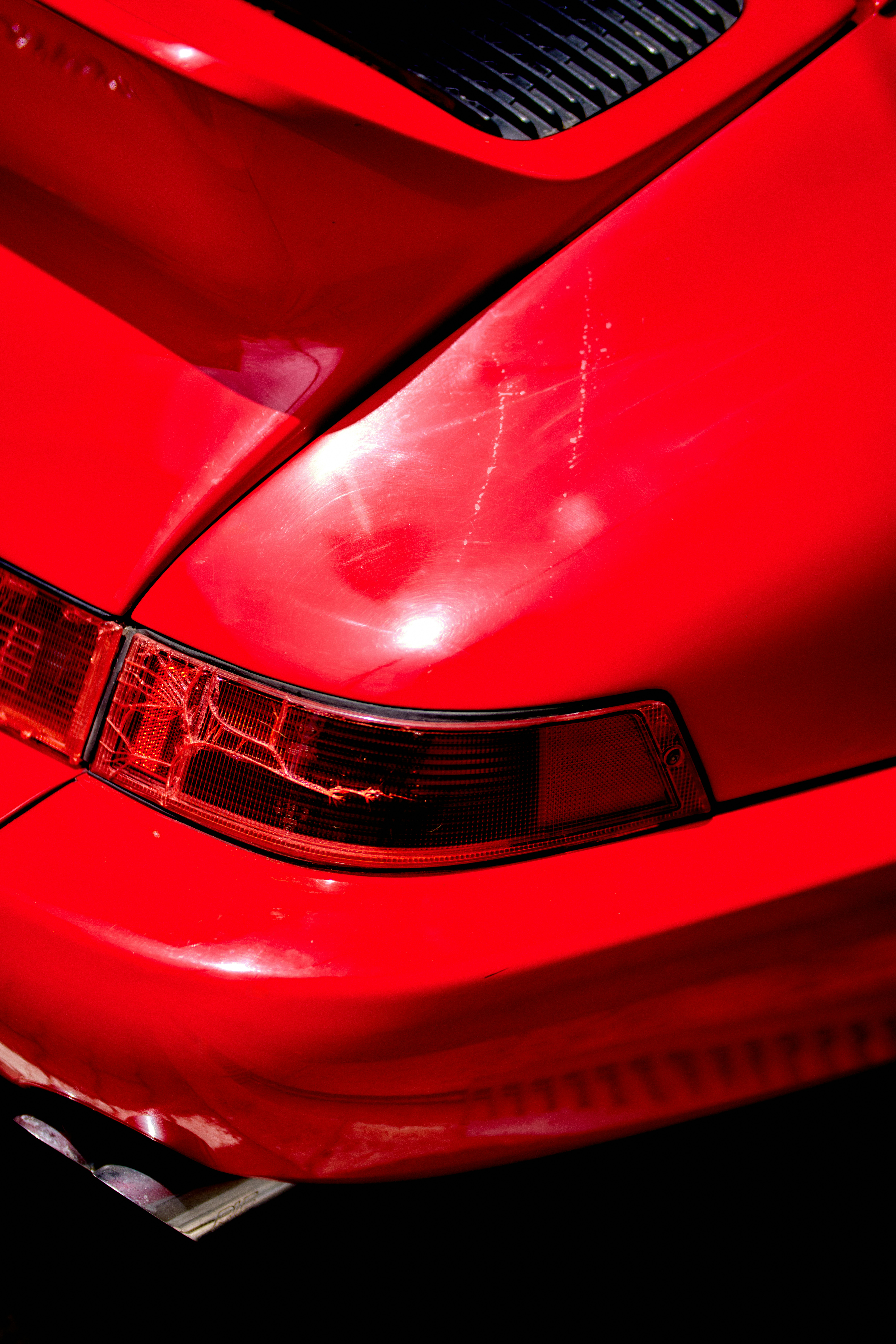 Bright red car's rear end, close-up. photo – Free Car Image on Unsplash