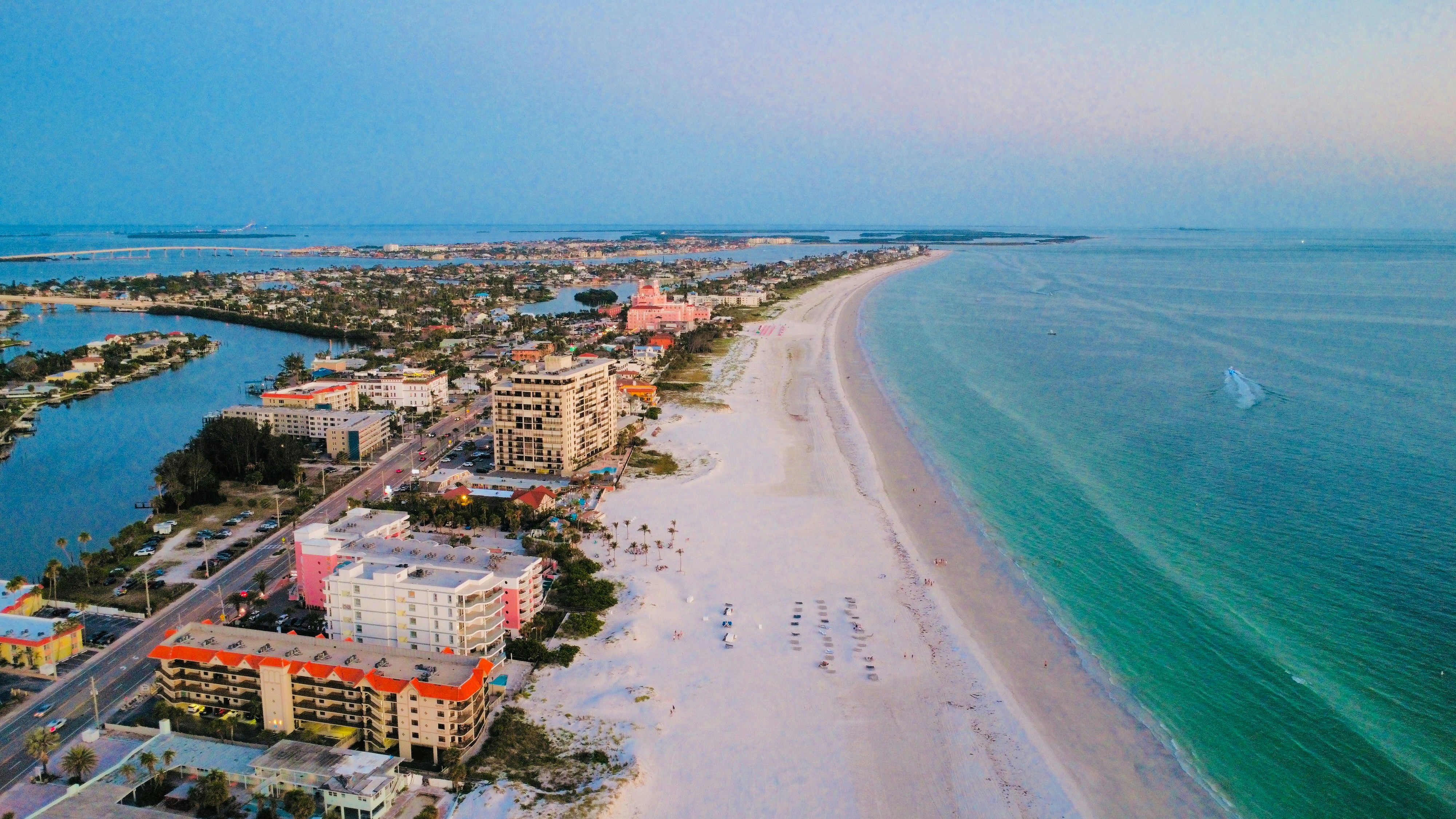 Beautiful beach with buildings beside the turquoise ocean. photo – Free ...