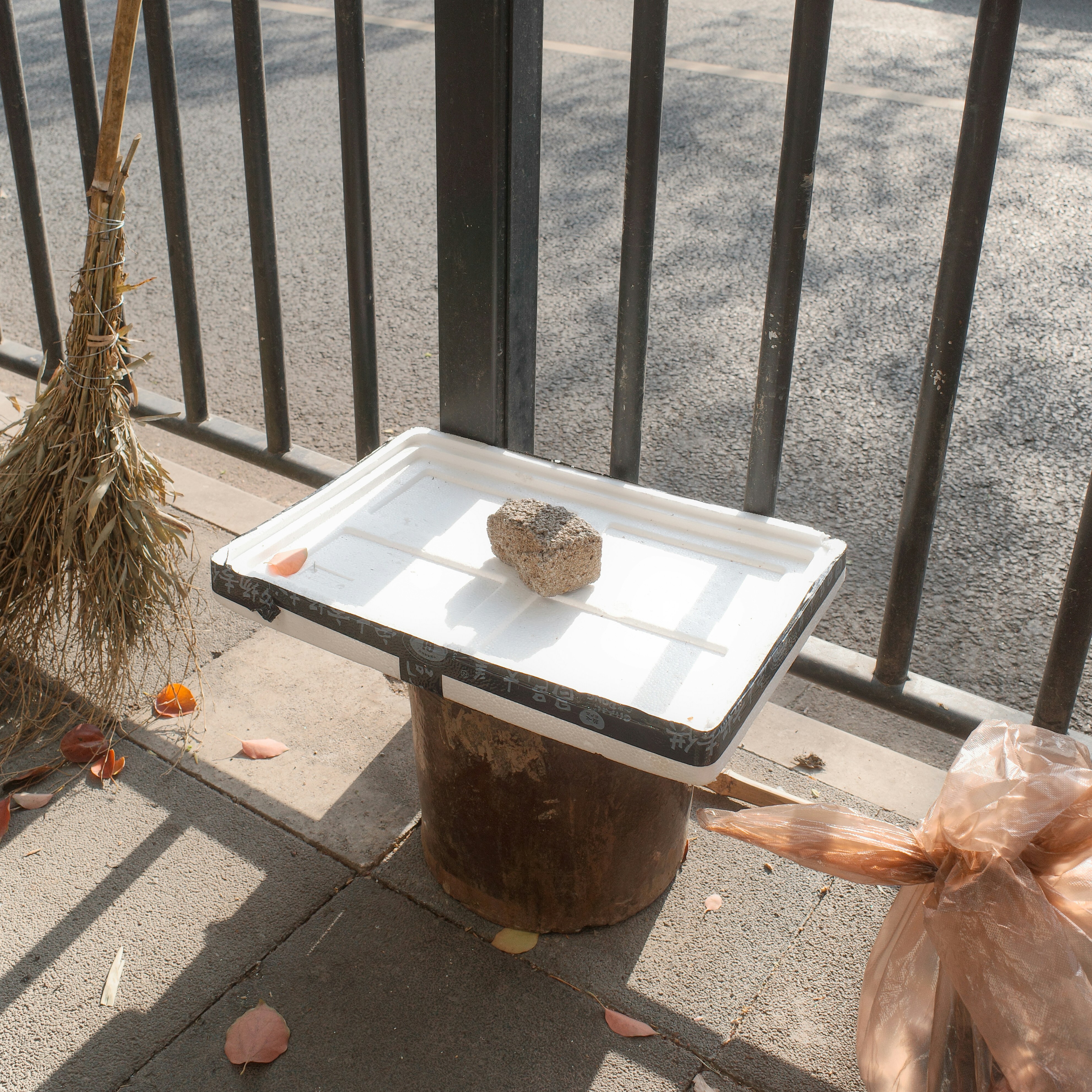 A Weathered Snack Stand Beside a Quiet Railing