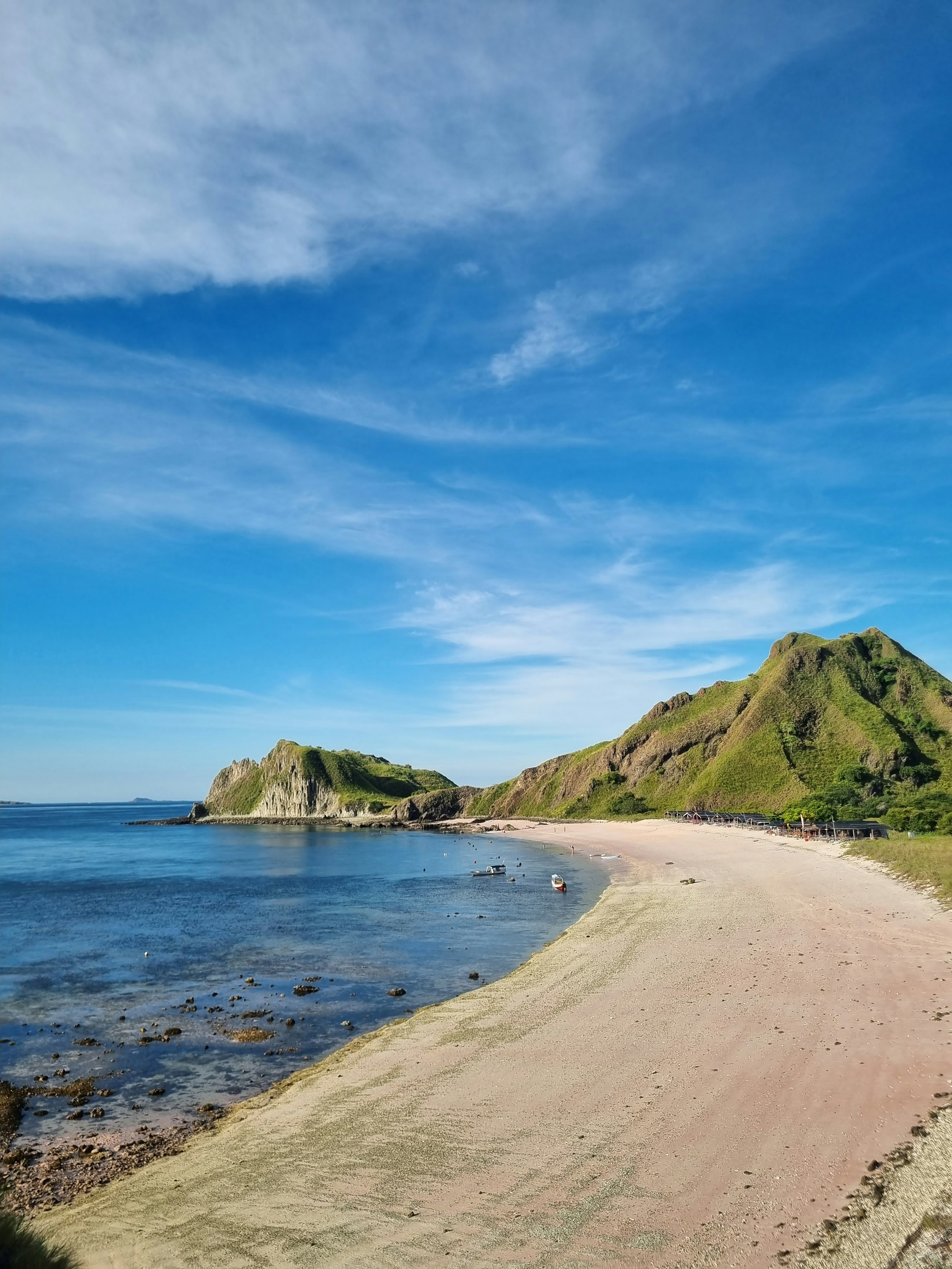 Coastal Ridge at Low Tide: A Quiet Shore Against Blue Horizons