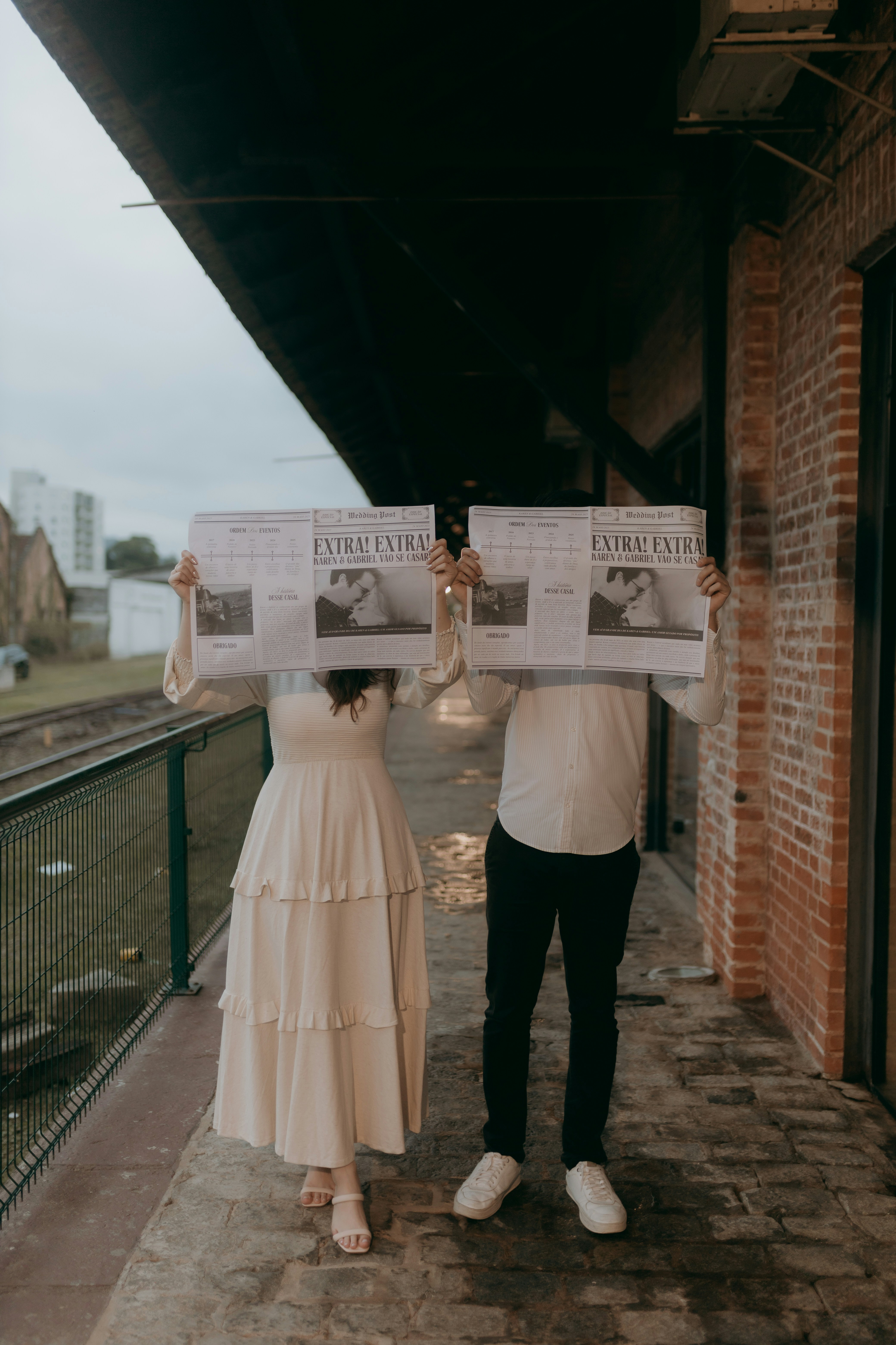 Two Figures, One Newspaper: A Quiet Platform Portrait Behind Headlines
