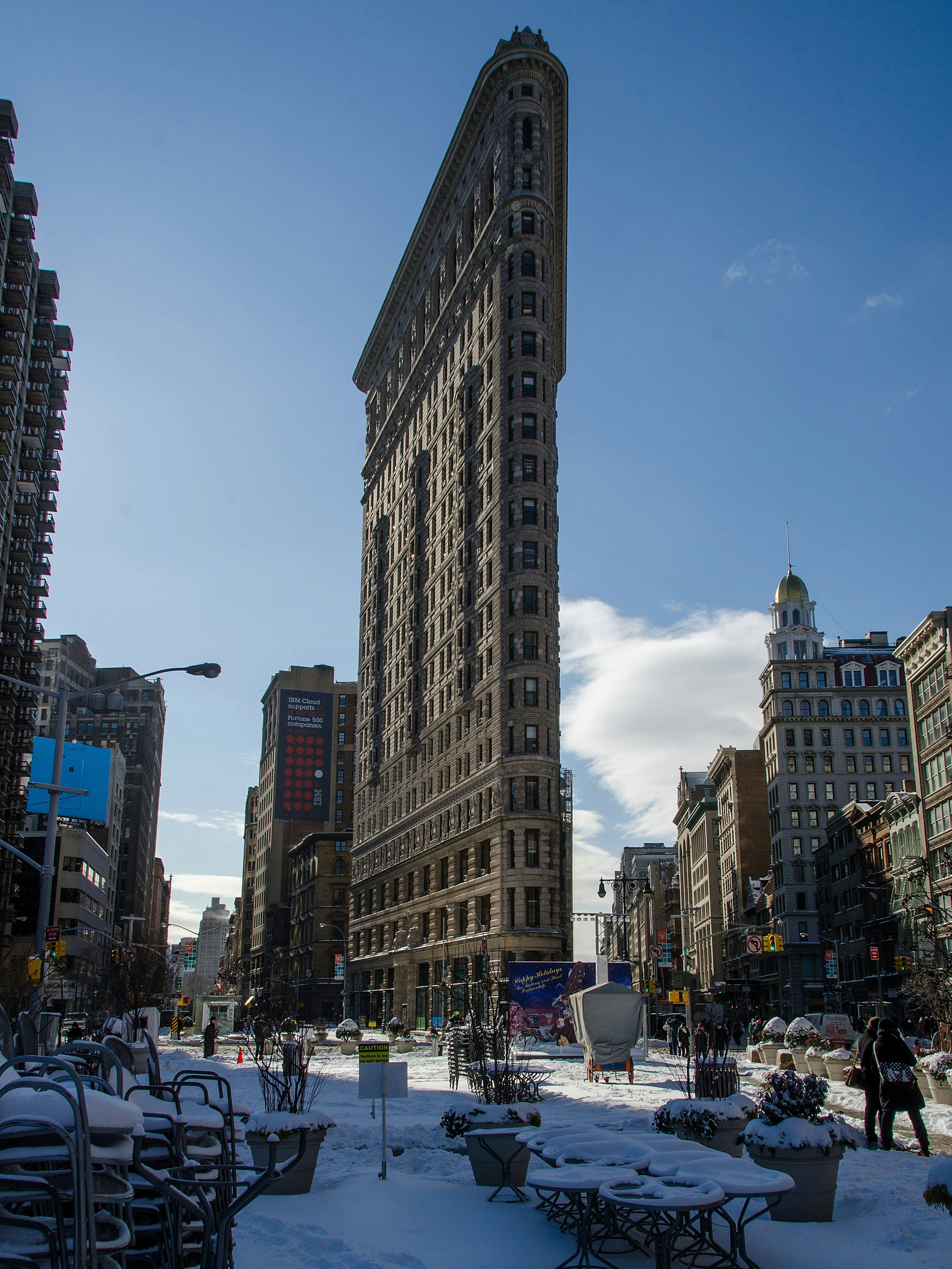 Leaned Monument in Snow: The Flatiron of New York in Winter Light