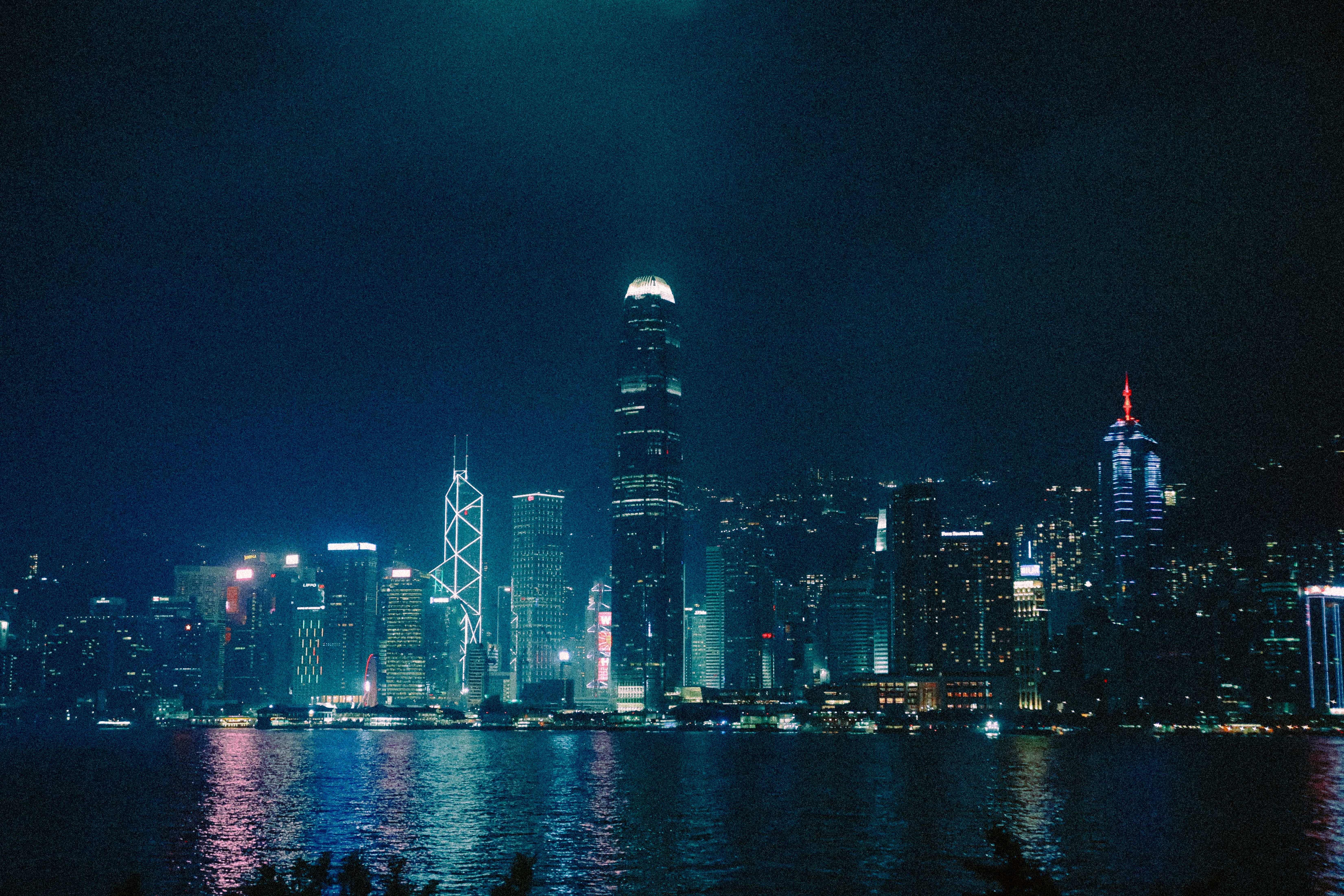 Hong kong's skyline glows brightly at night. photo – Free City Image on ...