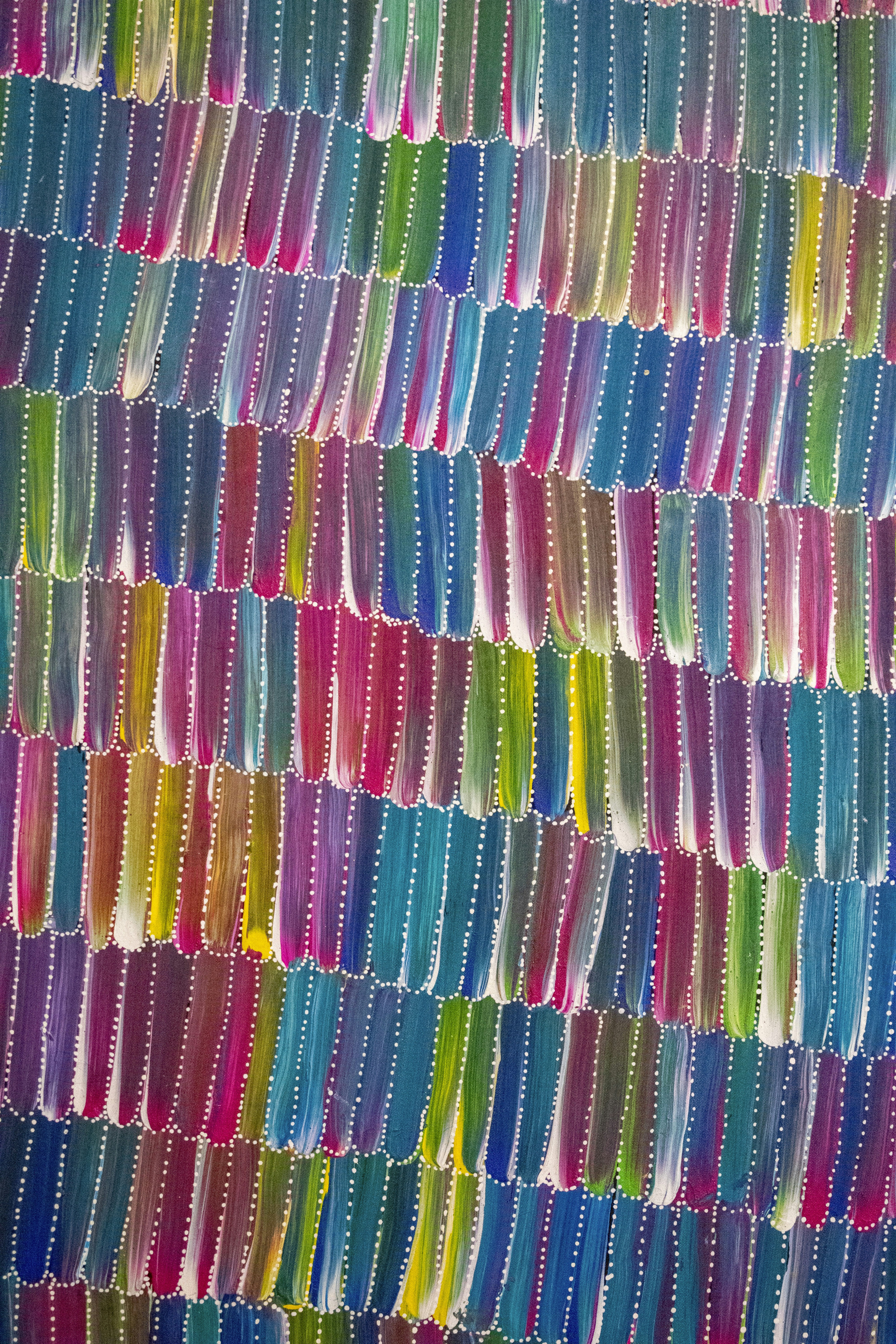 Rows of colorful vertical lines create a vibrant abstract artwork.