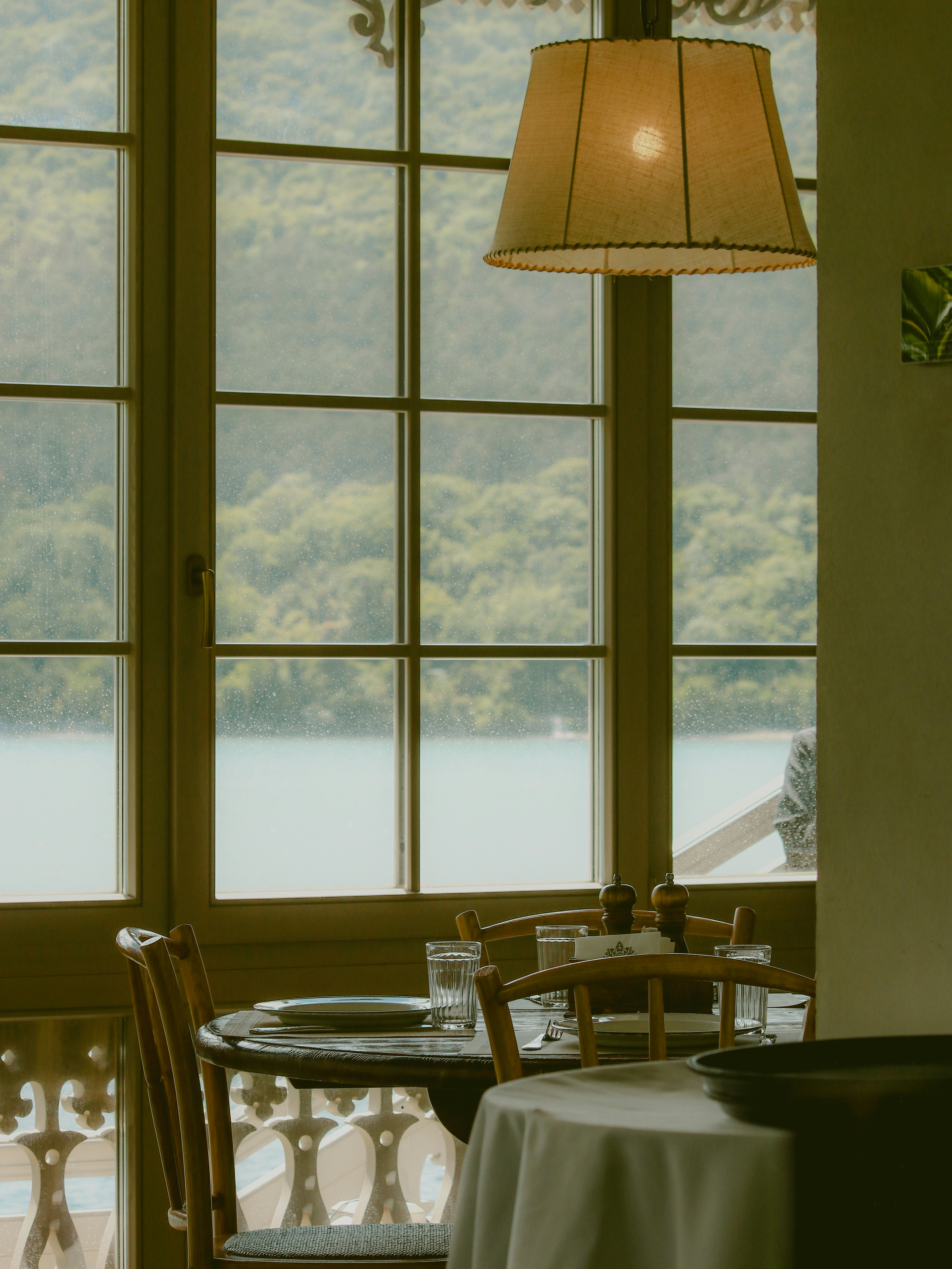 Cozy dining table by a scenic window. photo – Free Interior design ...