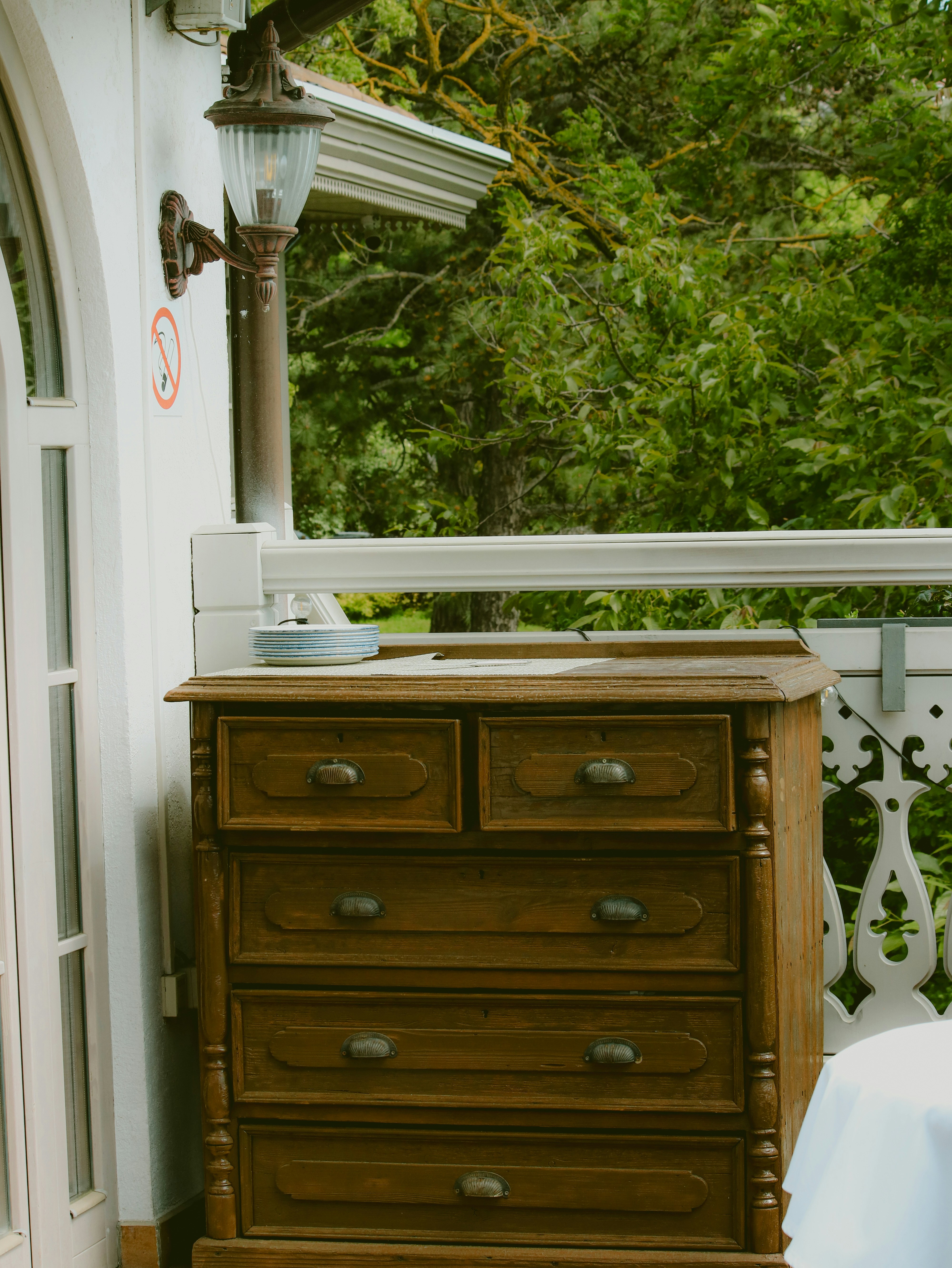 Porch Dresser Under a Leafy Canopy