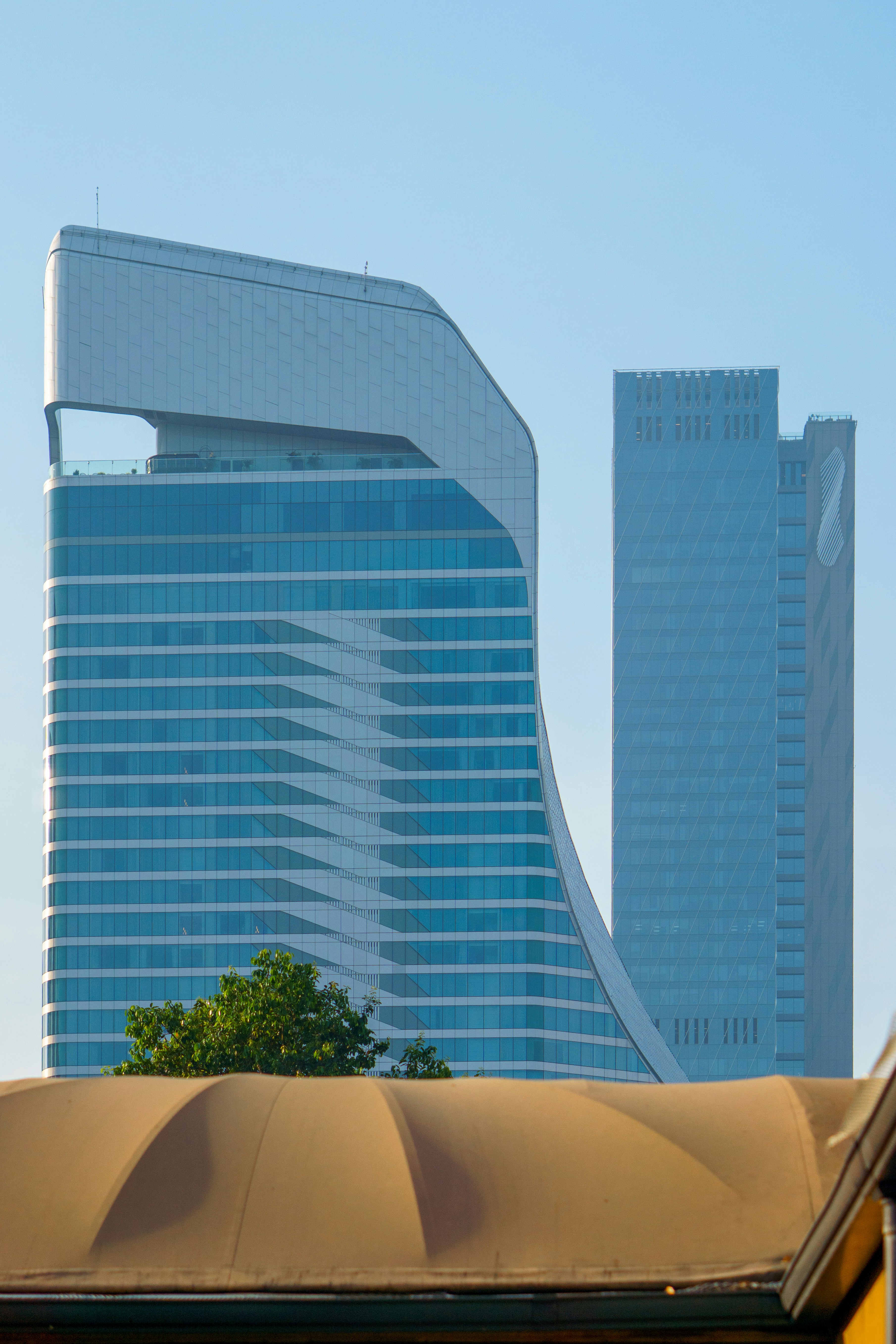 Sculpted Reflections: A Modern Architectural Duo