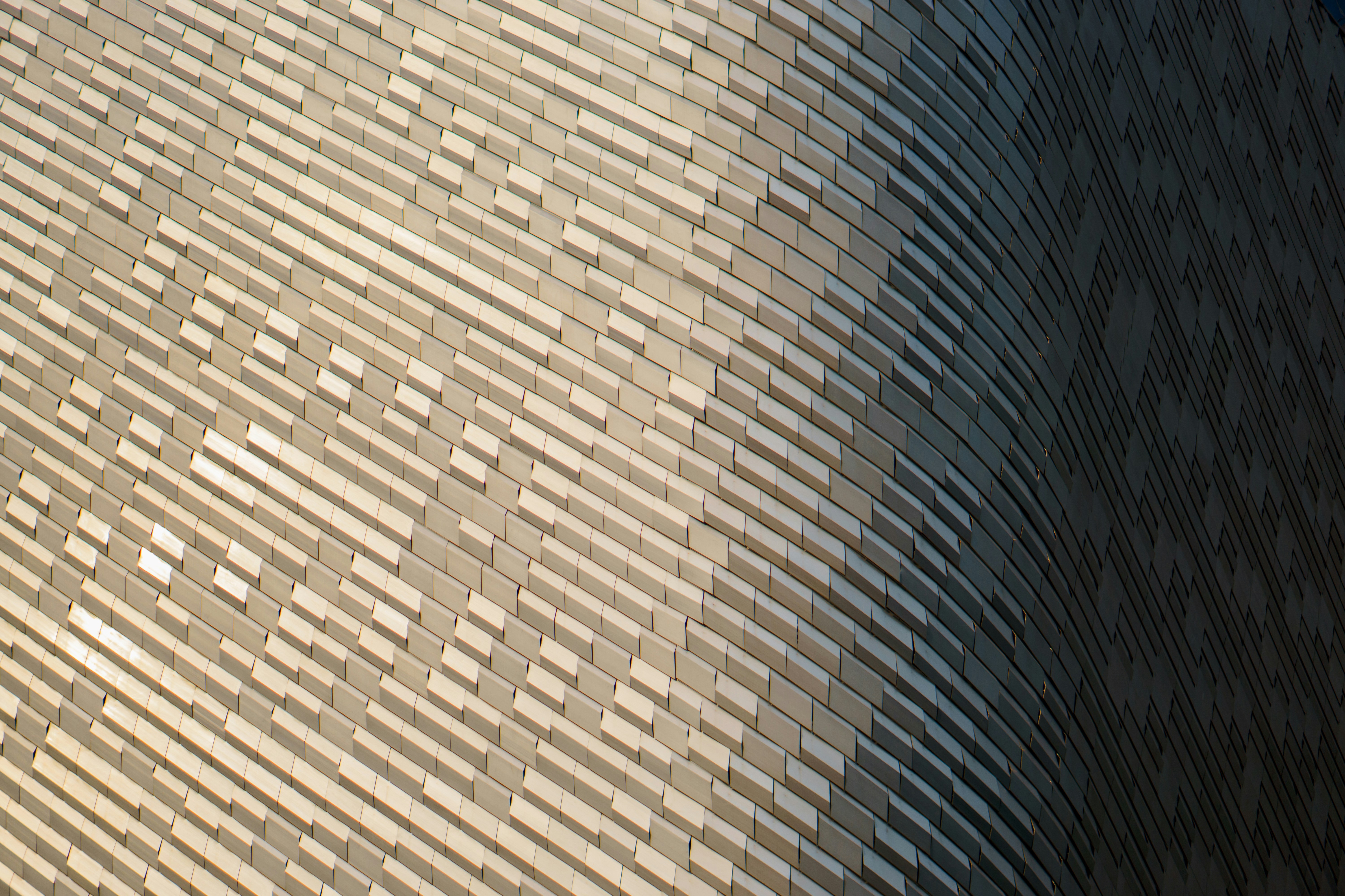 A wavy, brick-patterned wall receives sunlight. photo – Free Texture ...