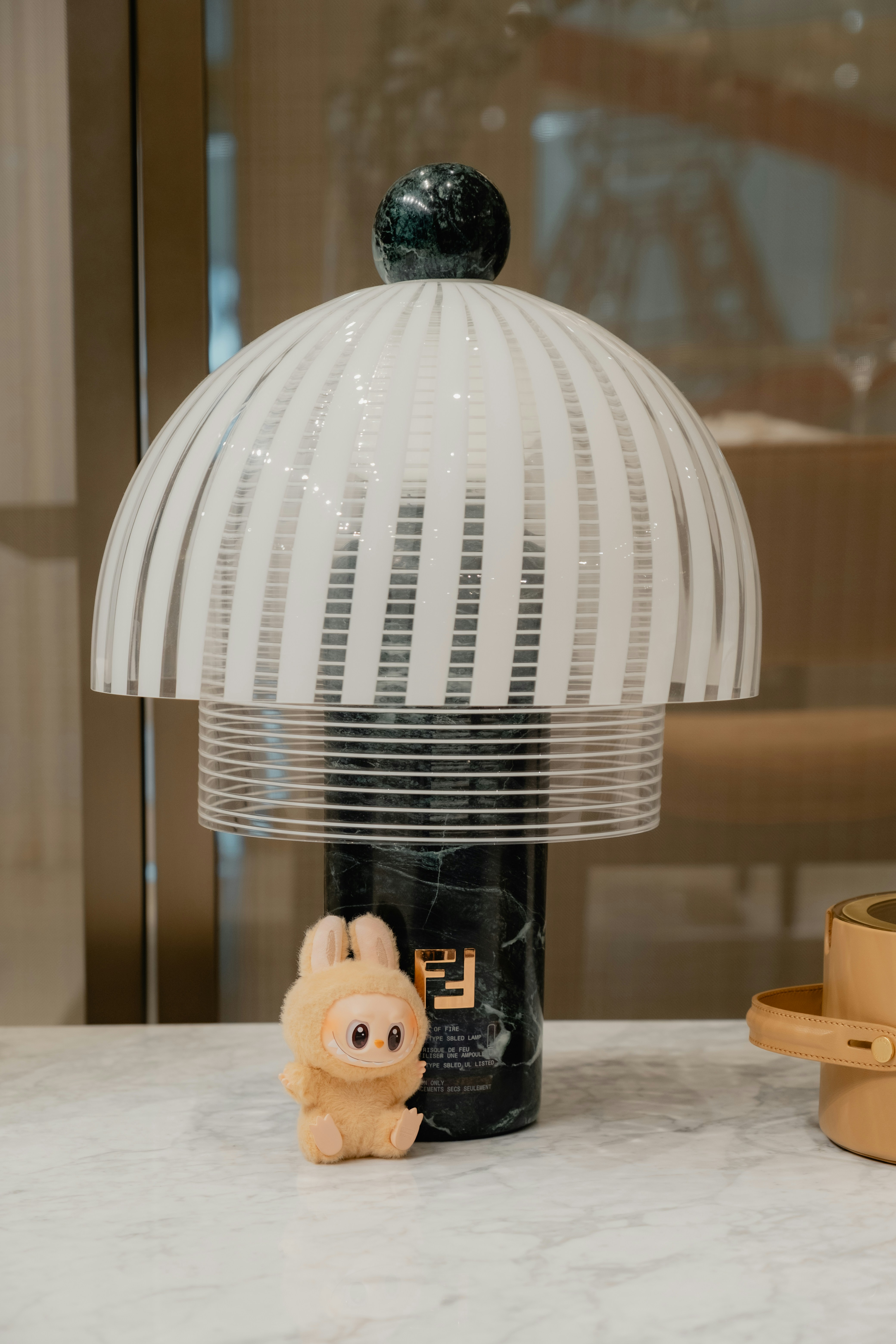 Orbital Lamp with Petite Plush: A Minimalist Still Life