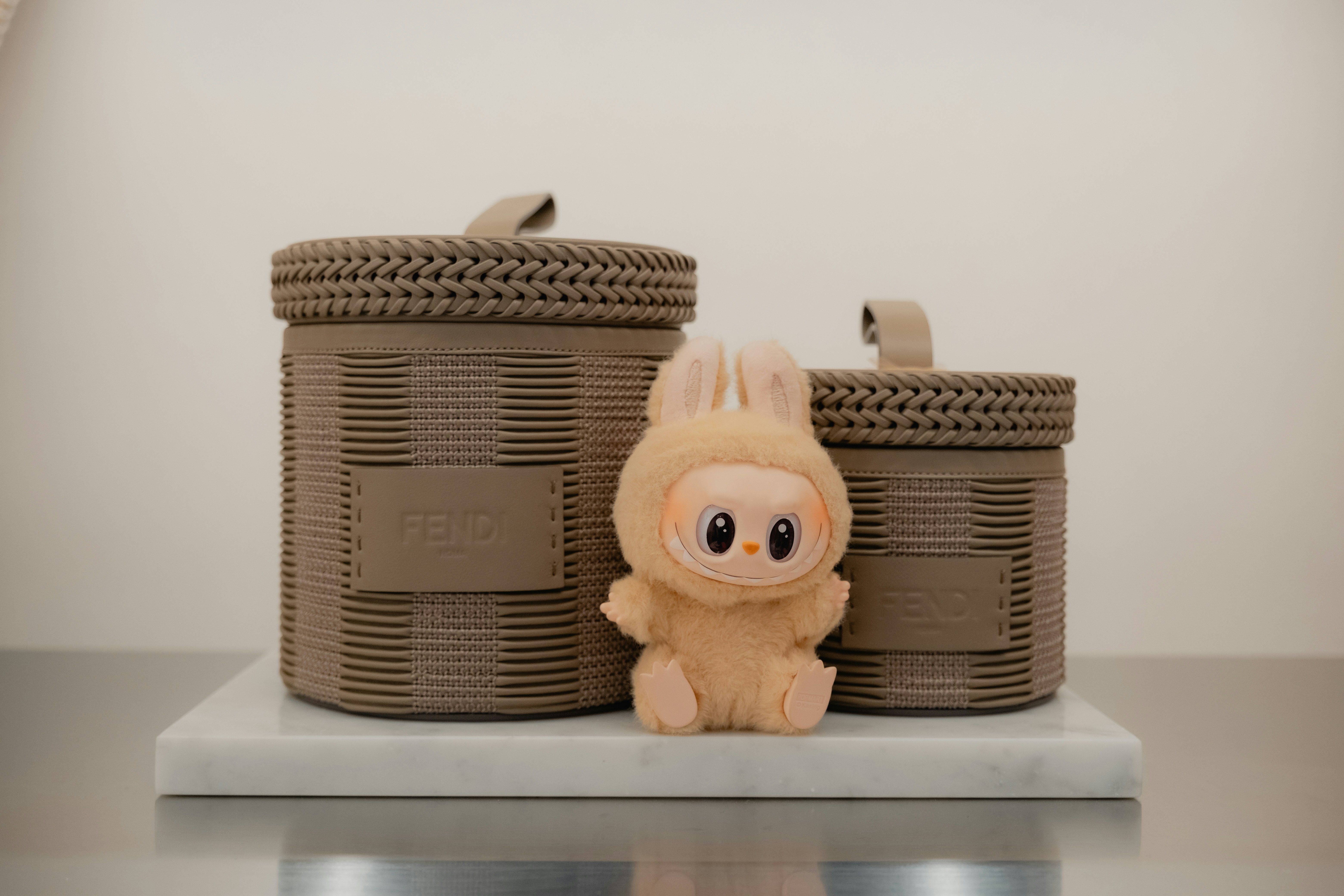 Cute stuffed animal between two decorative containers. photo – Free Art ...
