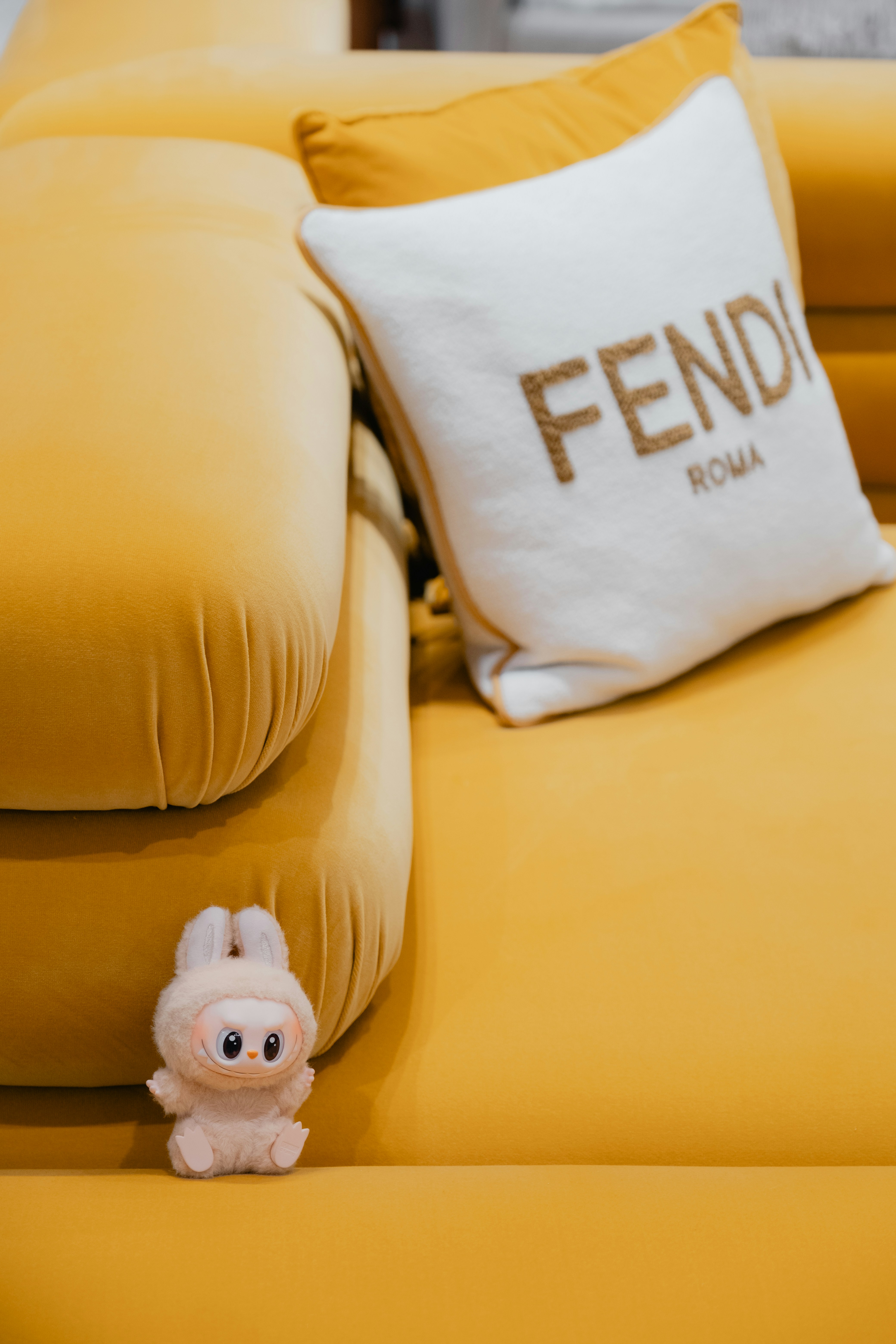 Tiny Bunny Scout on a Velvet Sunset Sofa