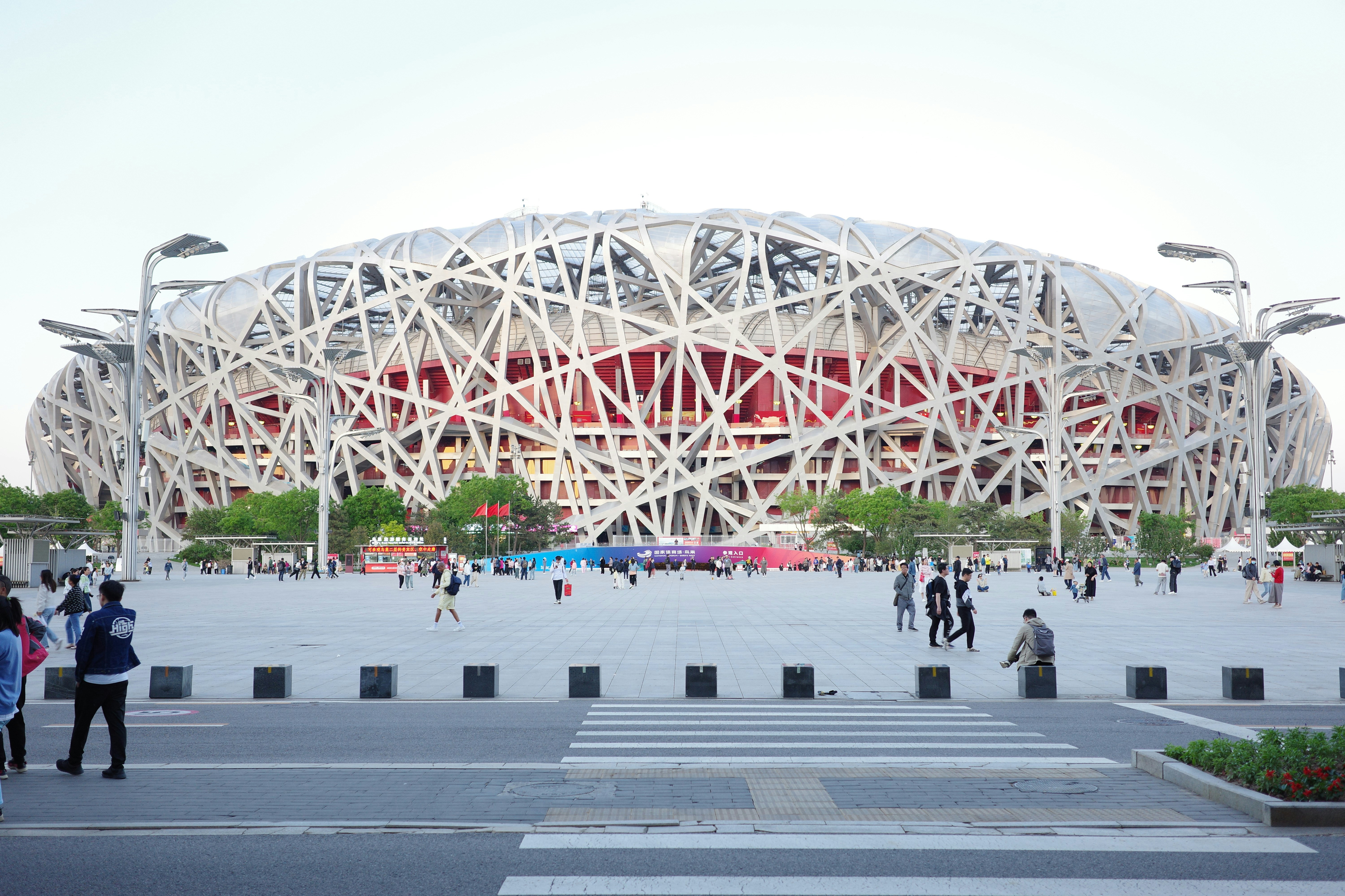 Here's a possible caption: beijing's iconic bird's nest stadium is ...