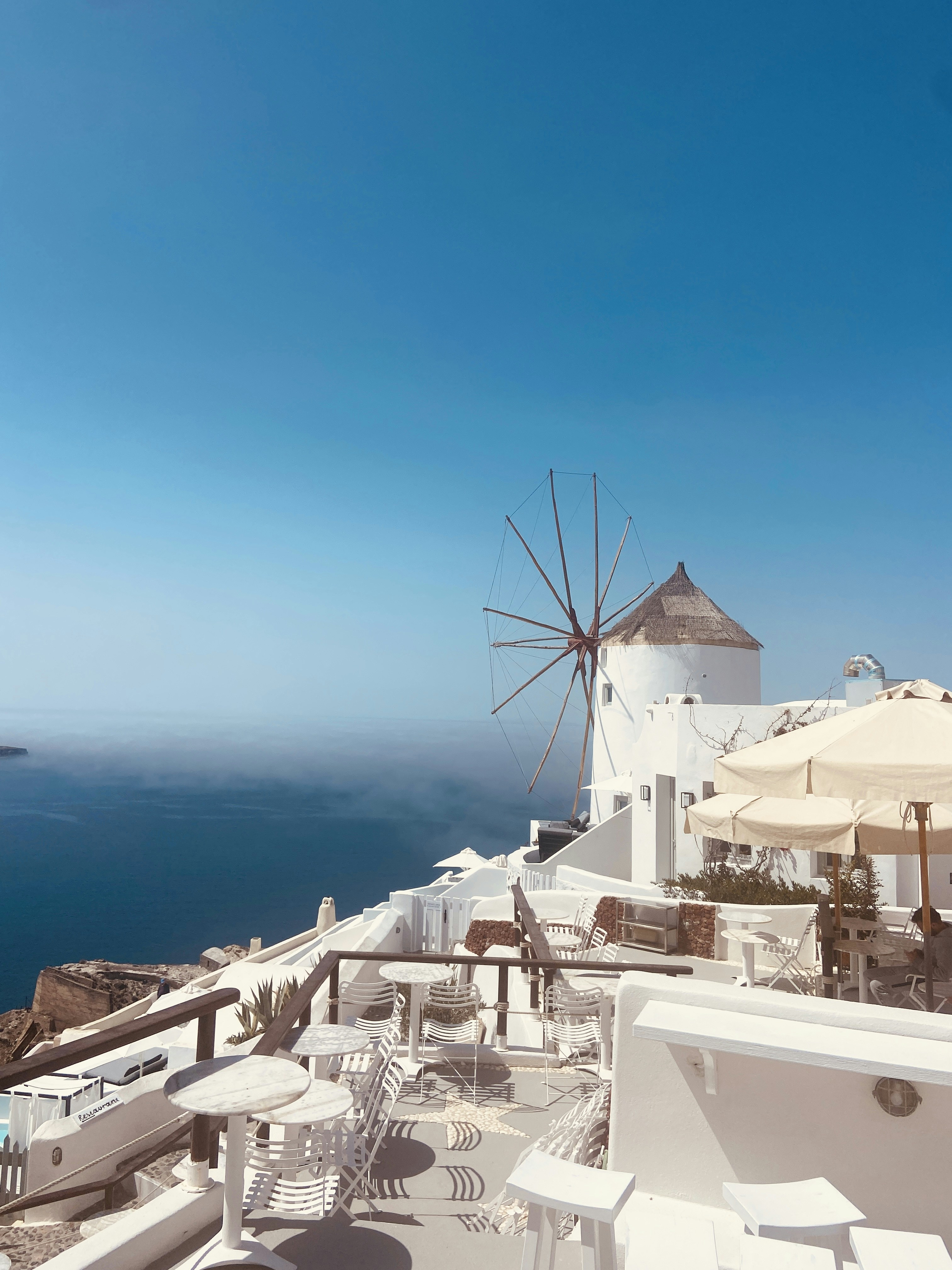 Aegean Windmill Terrace: Whitewashed Architecture Against the Blue Horizon