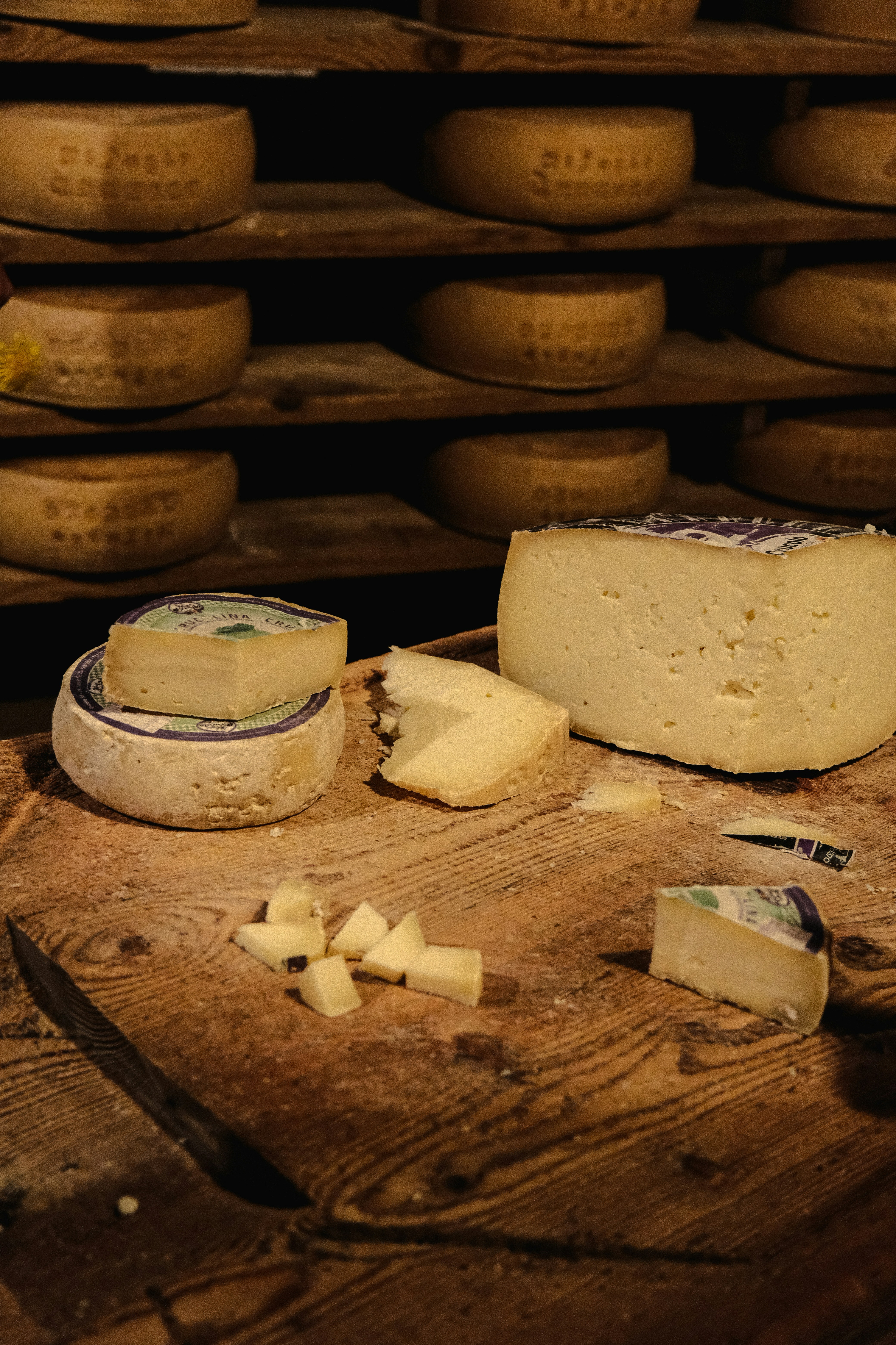 Cheese samples are displayed on a rustic wooden board. photo – Free ...