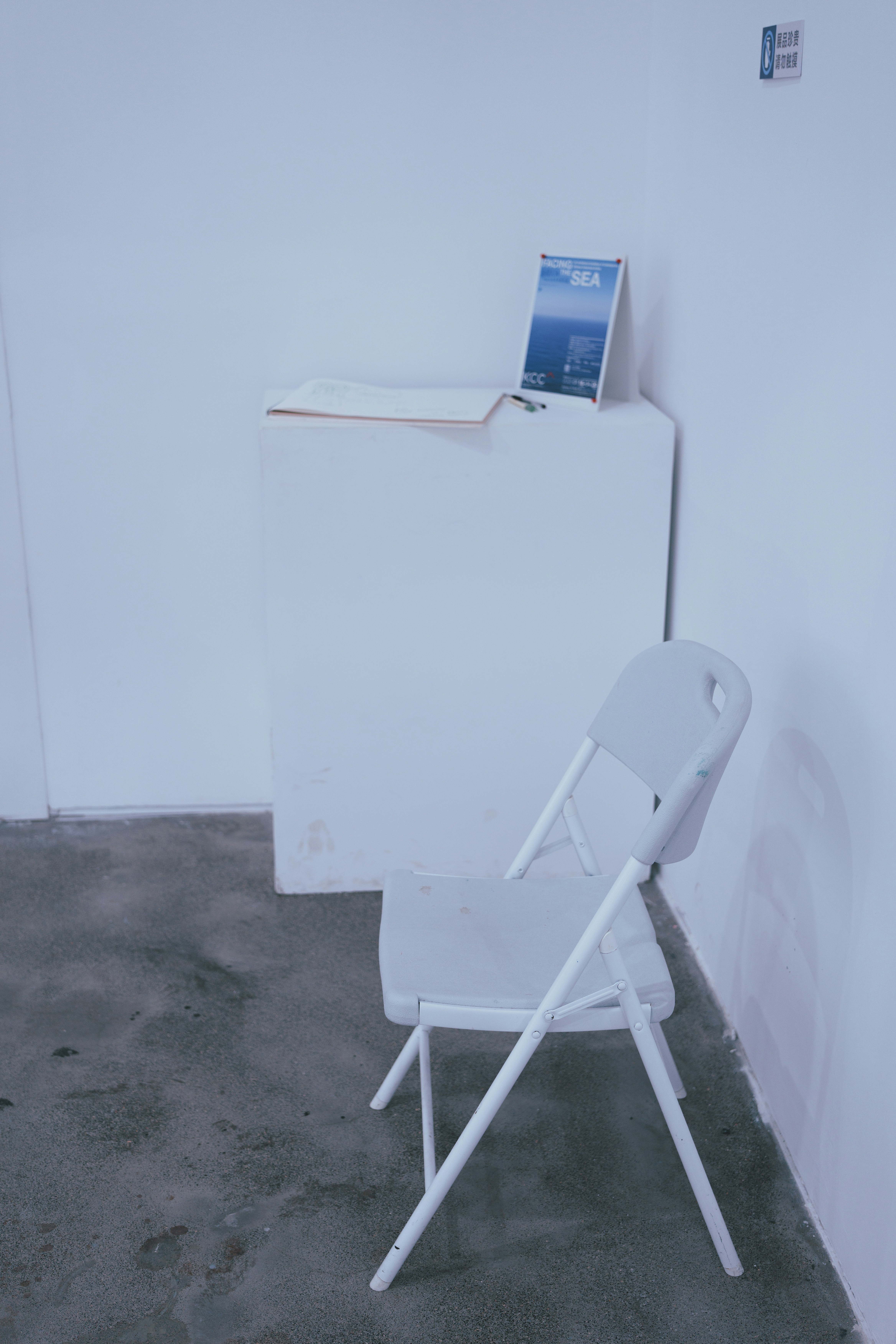 Quiet Geometry in White: A Folding Chair Anchors a Minimal Corner