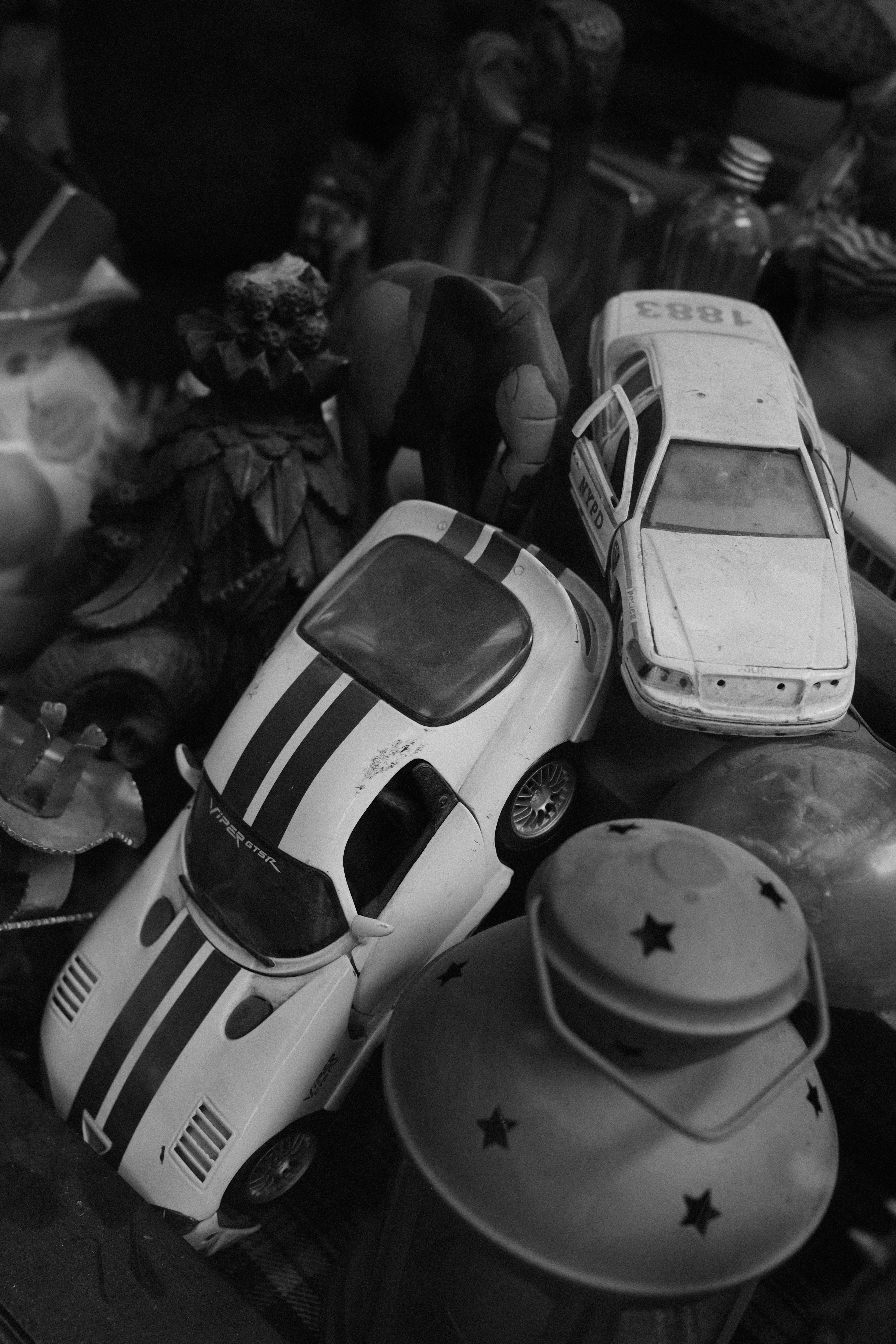 Monochrome Toy-Car Tangle: A Quiet Diorama of Cluttered Playthings