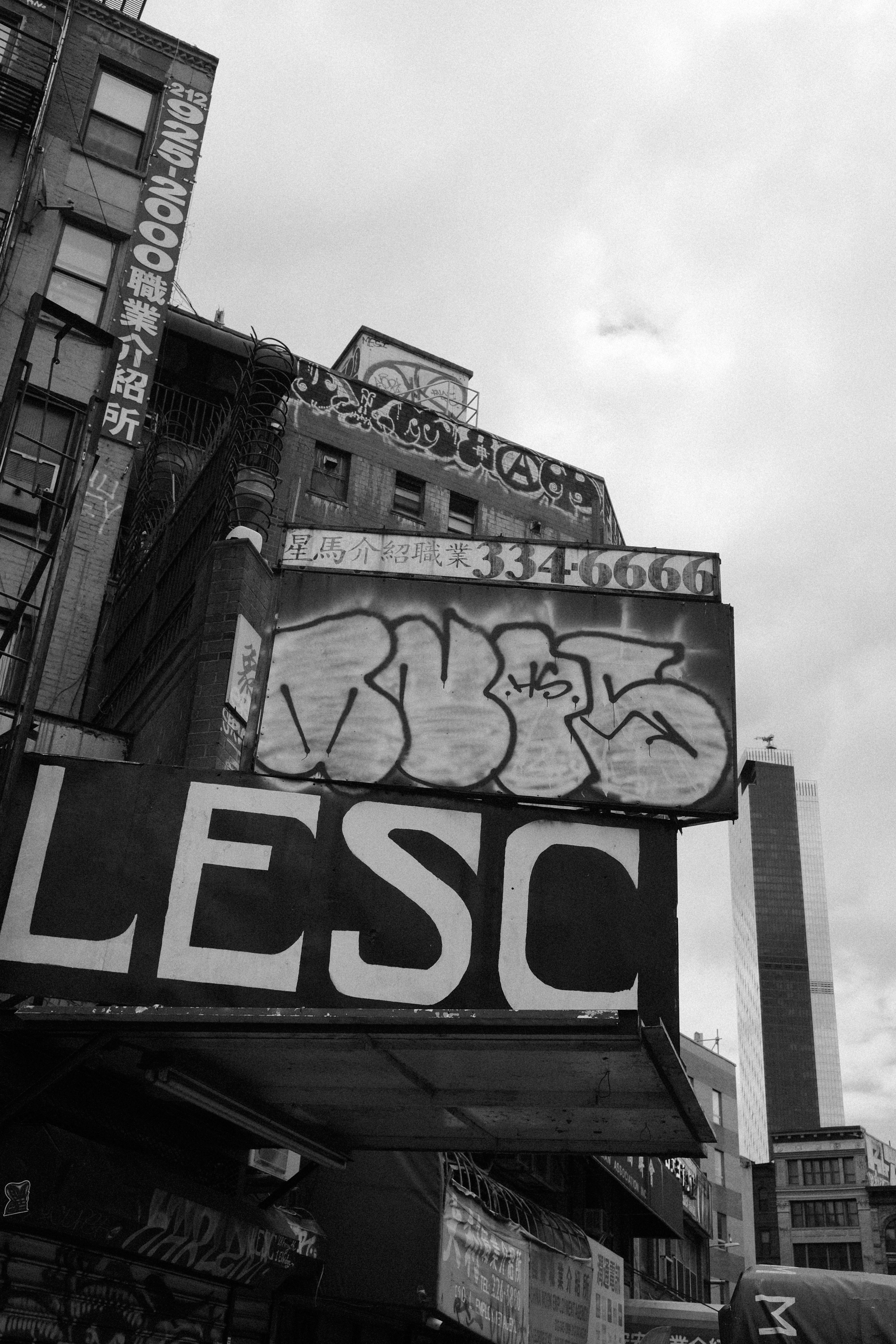 Graffiti Overhang: Neon Signs and Concrete Skyscrapers