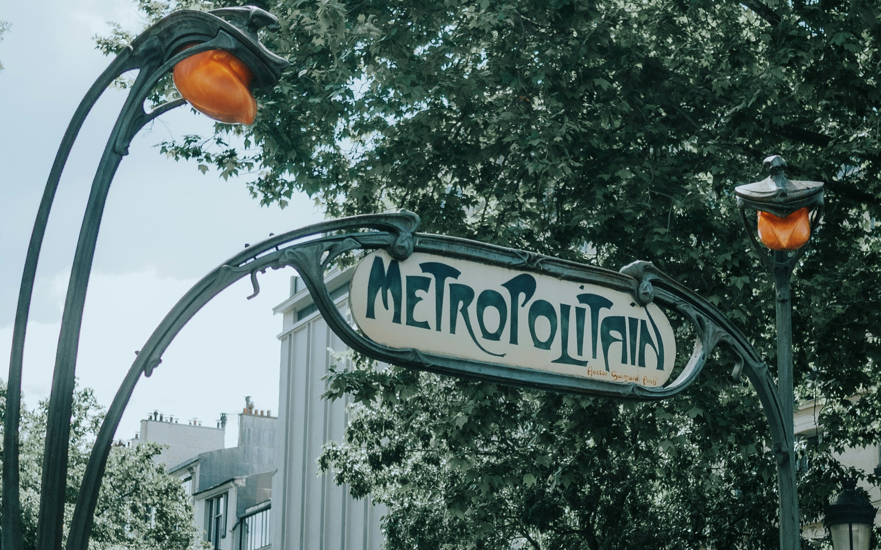 Art Nouveau Metropolitain Arch: Green Iron Lines Framing a Parisian Entrance