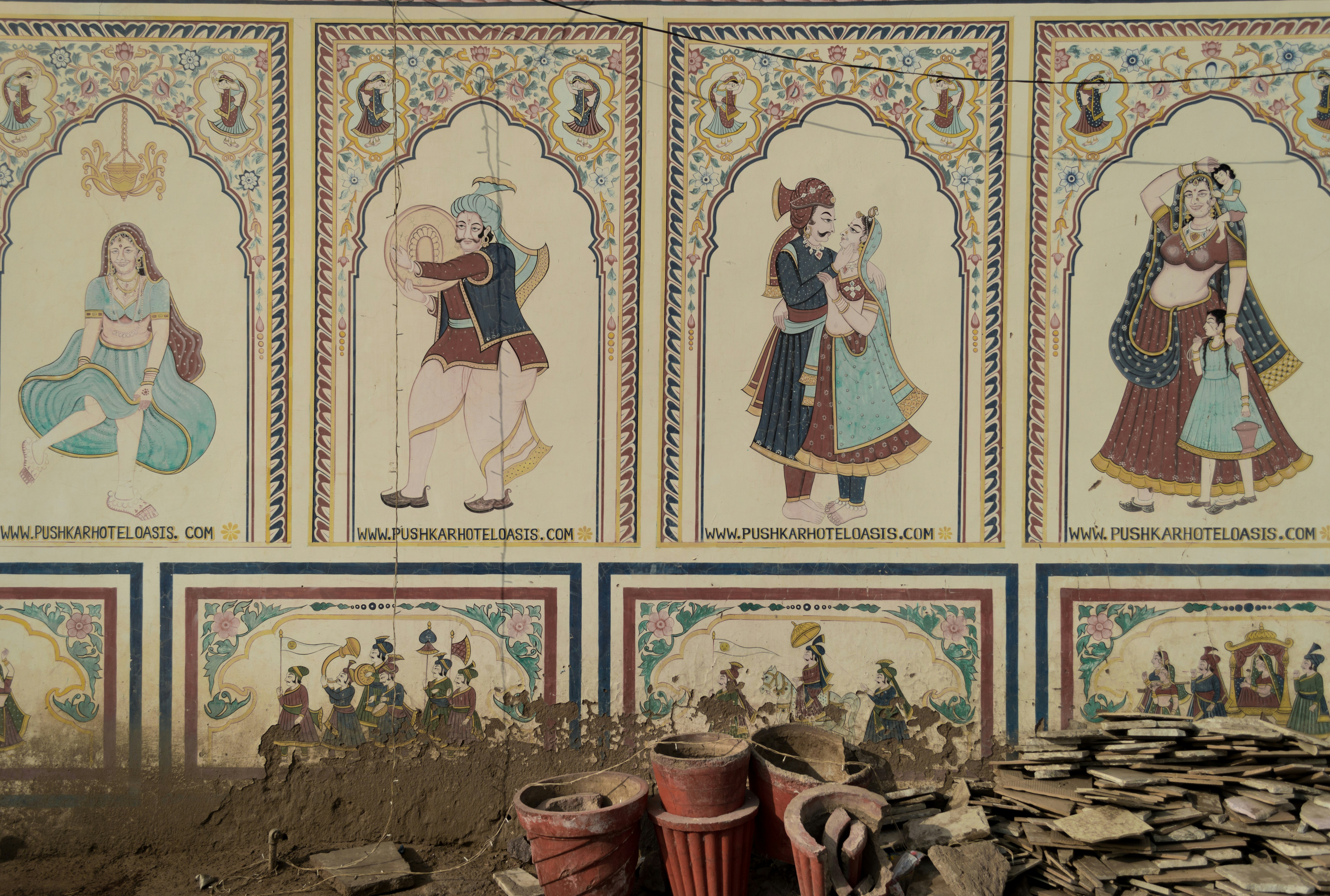 Folk-Art Frieze: Painted Tales Above a Pile of Firewood