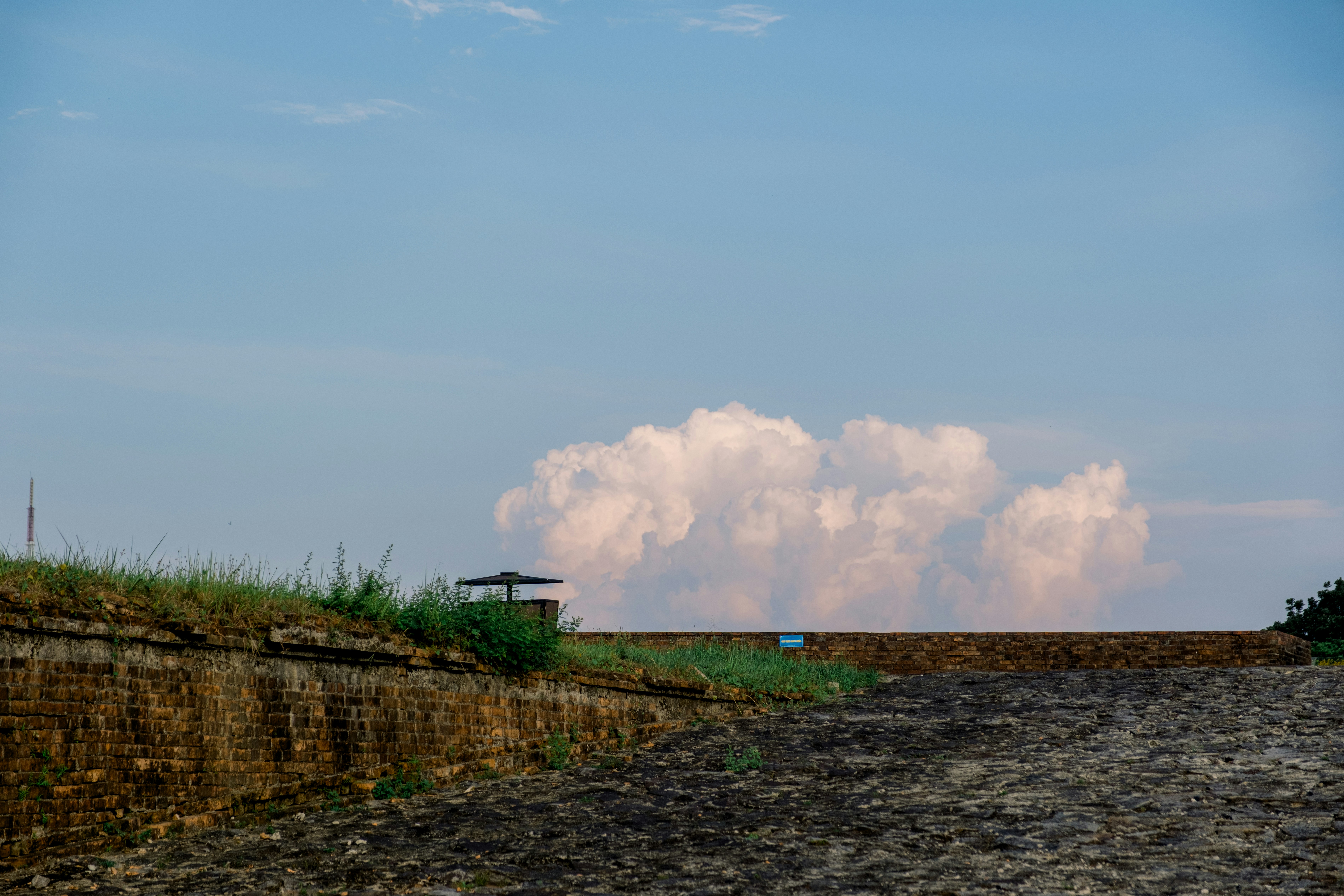 A puffy cloud hovers over the distant landscape.