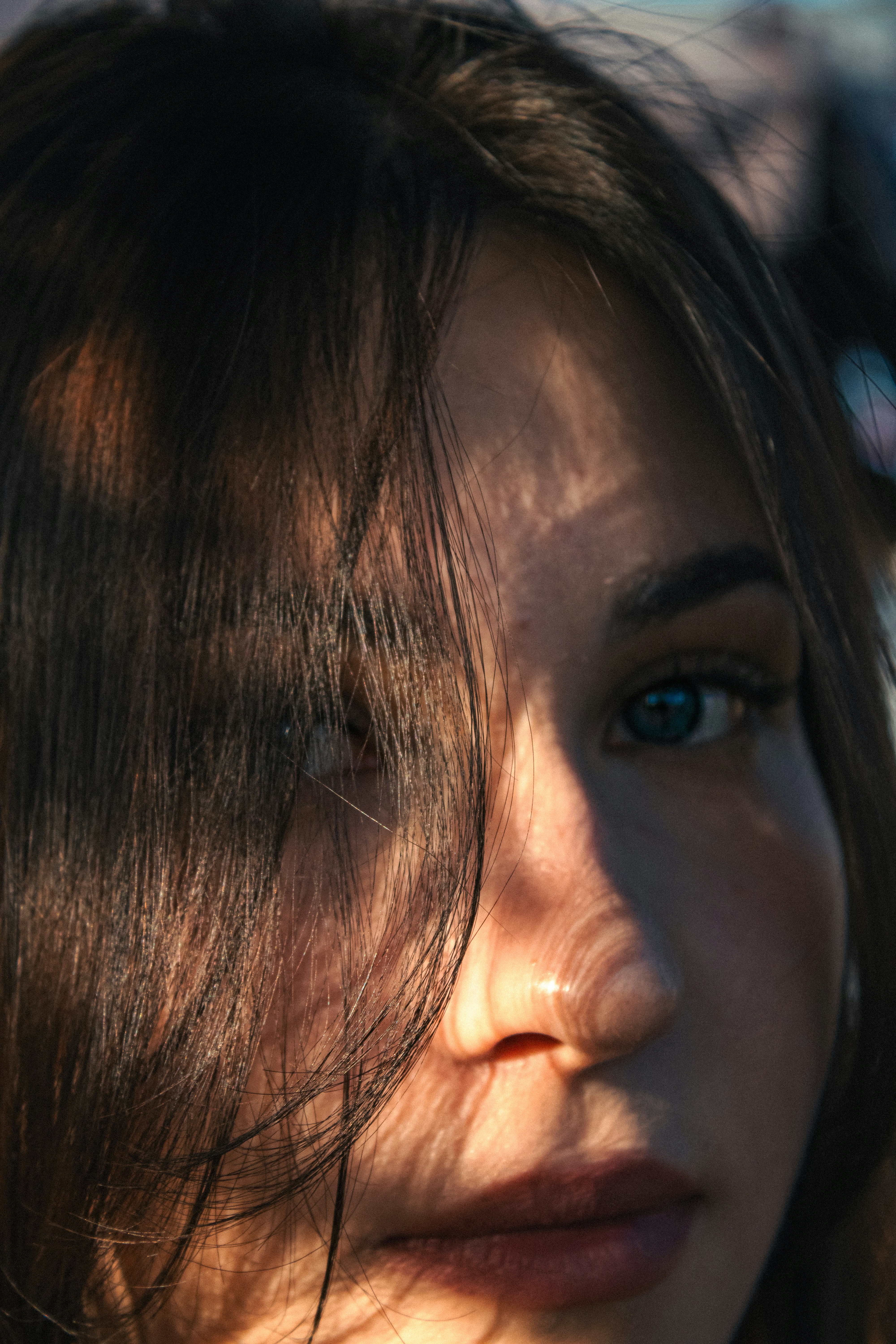 A woman's face is partially obscured by shadows. photo – Free Woman ...
