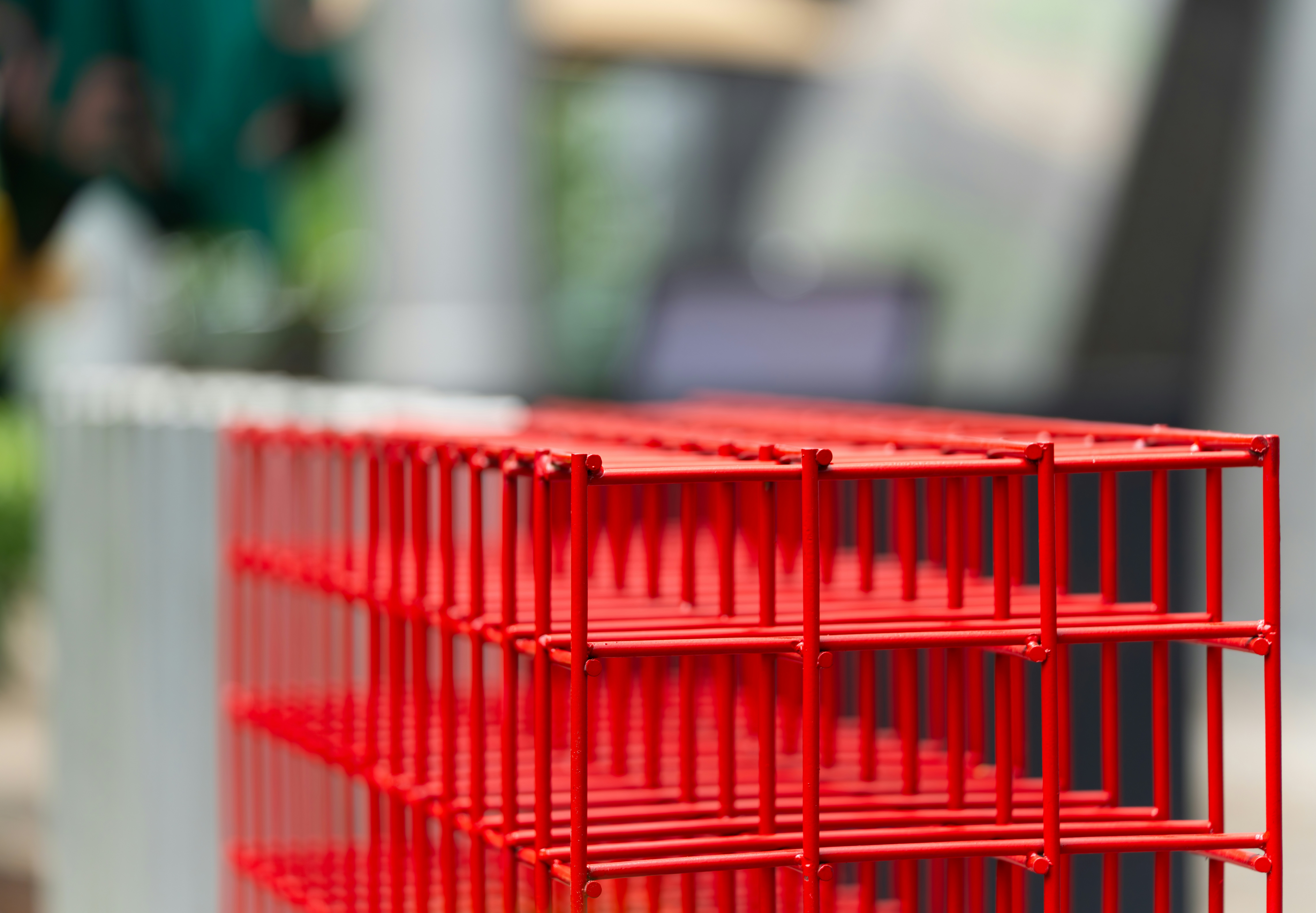 Crimson Lattice in Focus: A Close-Up of Red Steel Grid