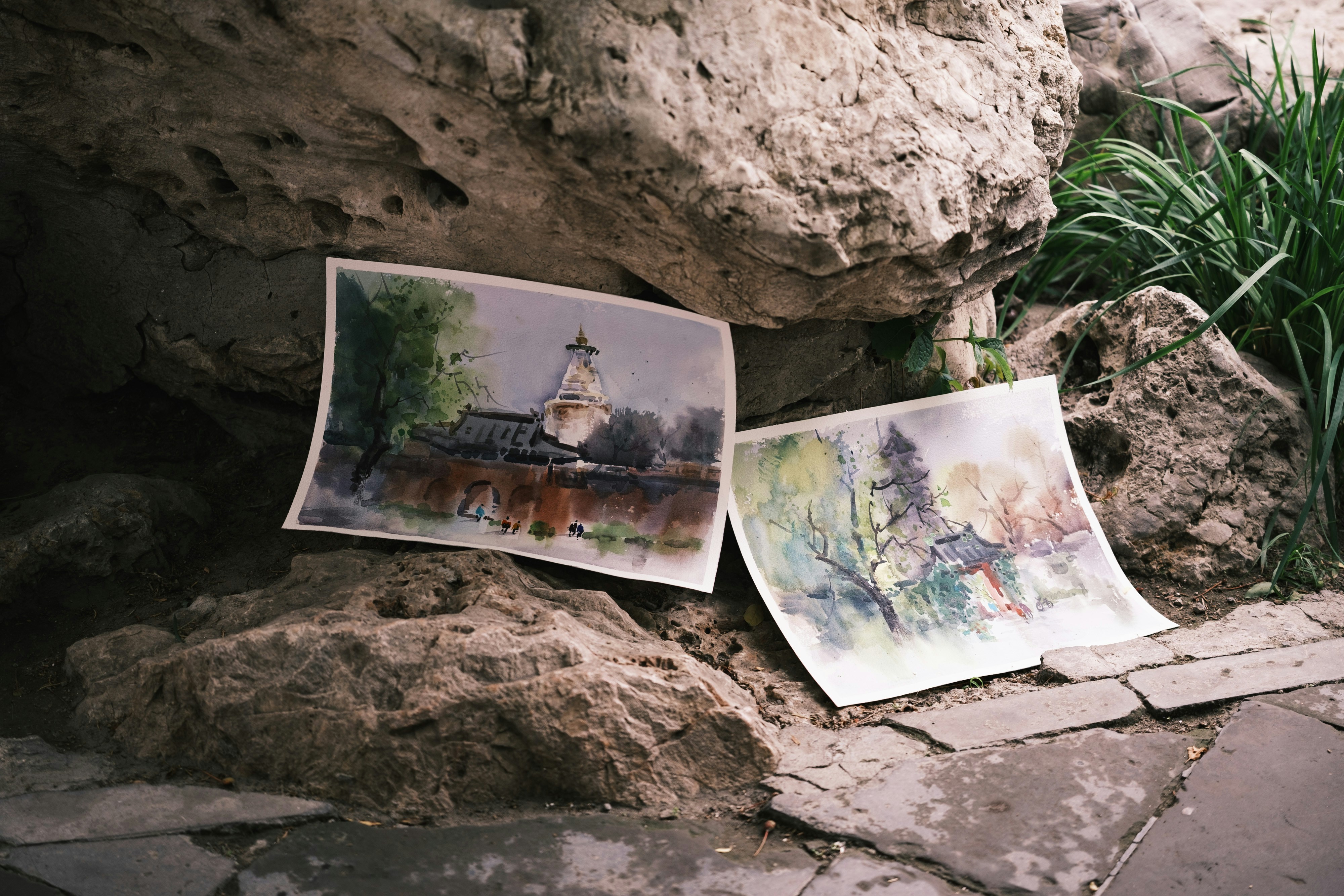 Two Watercolor Postcards on Weathered Rock: a Quiet Dialogue of Art and Stone