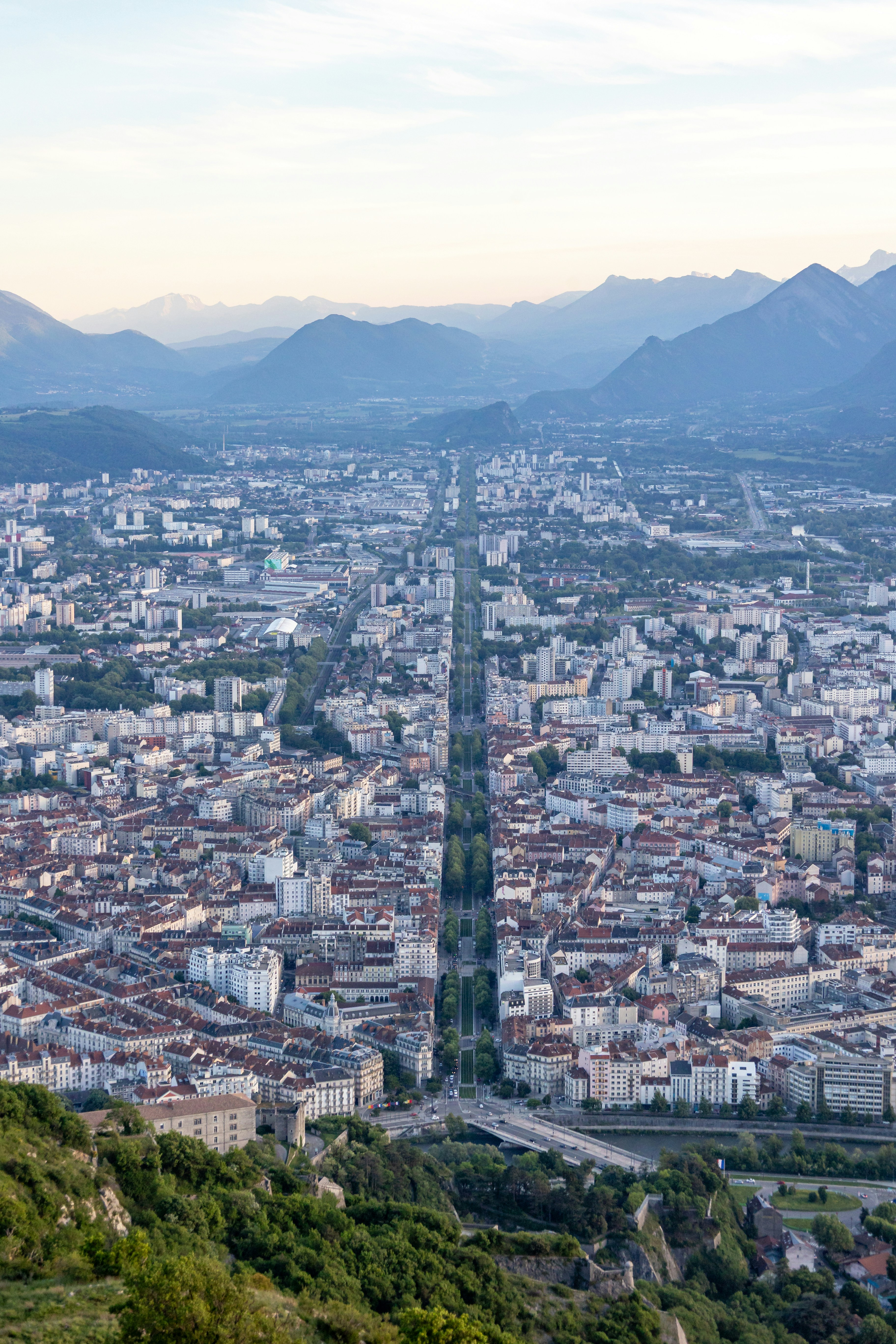 The City’s Spine: Aerial Boulevard Toward the Alpine Horizon