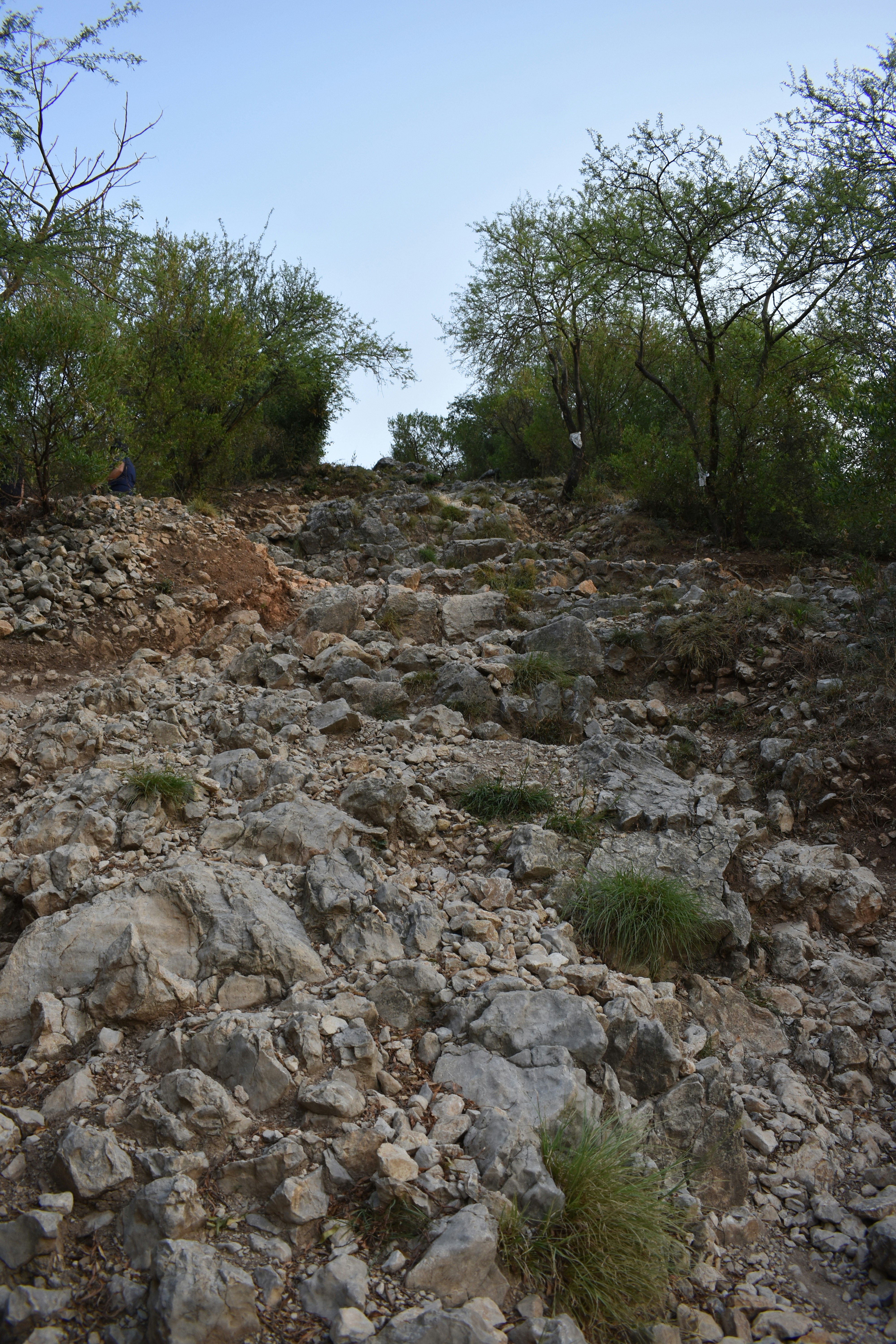 Ridge Between Stones: A Quiet Ascent Under Blue Sky