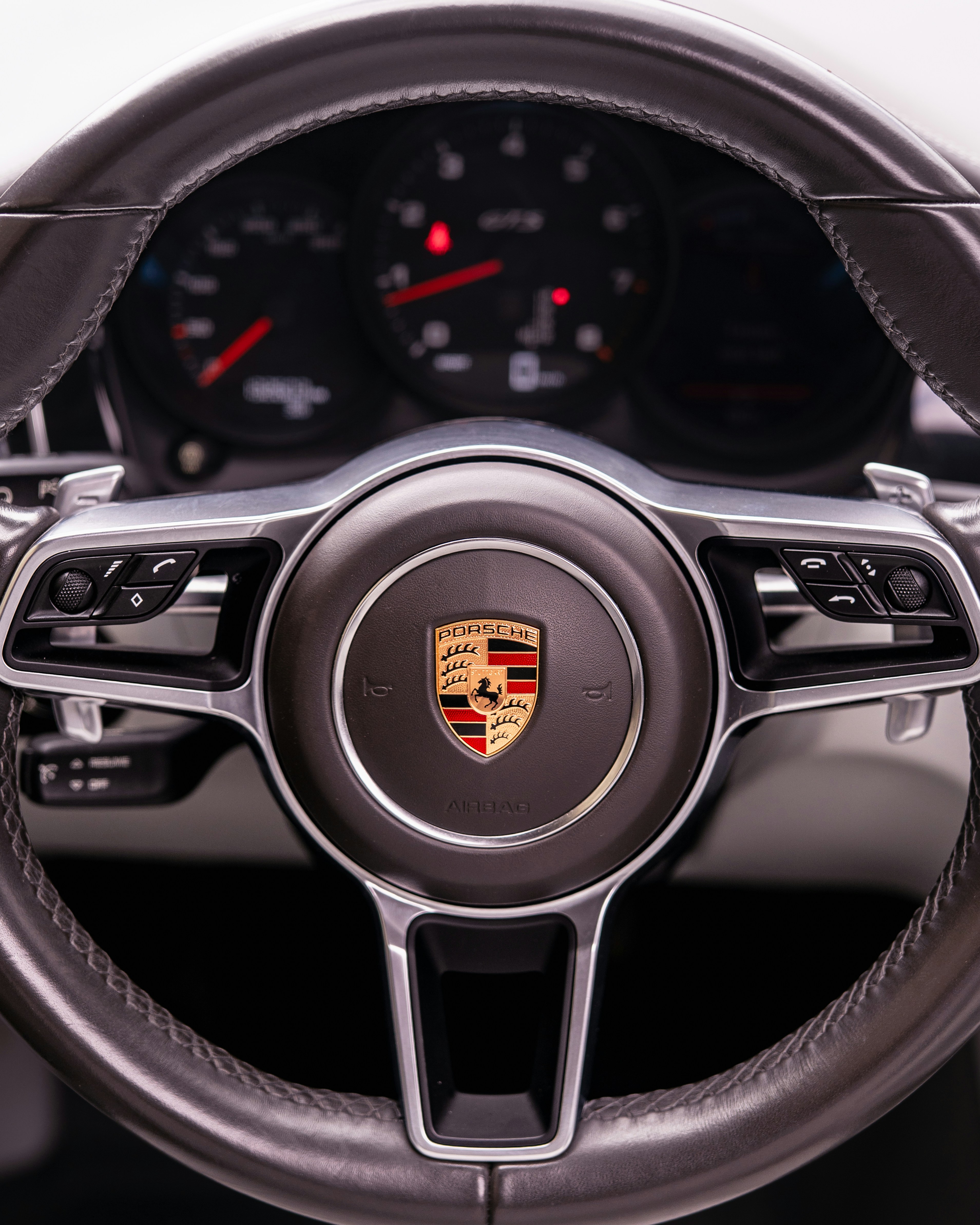 A close-up of a porsche steering wheel. photo – Free Interior design ...