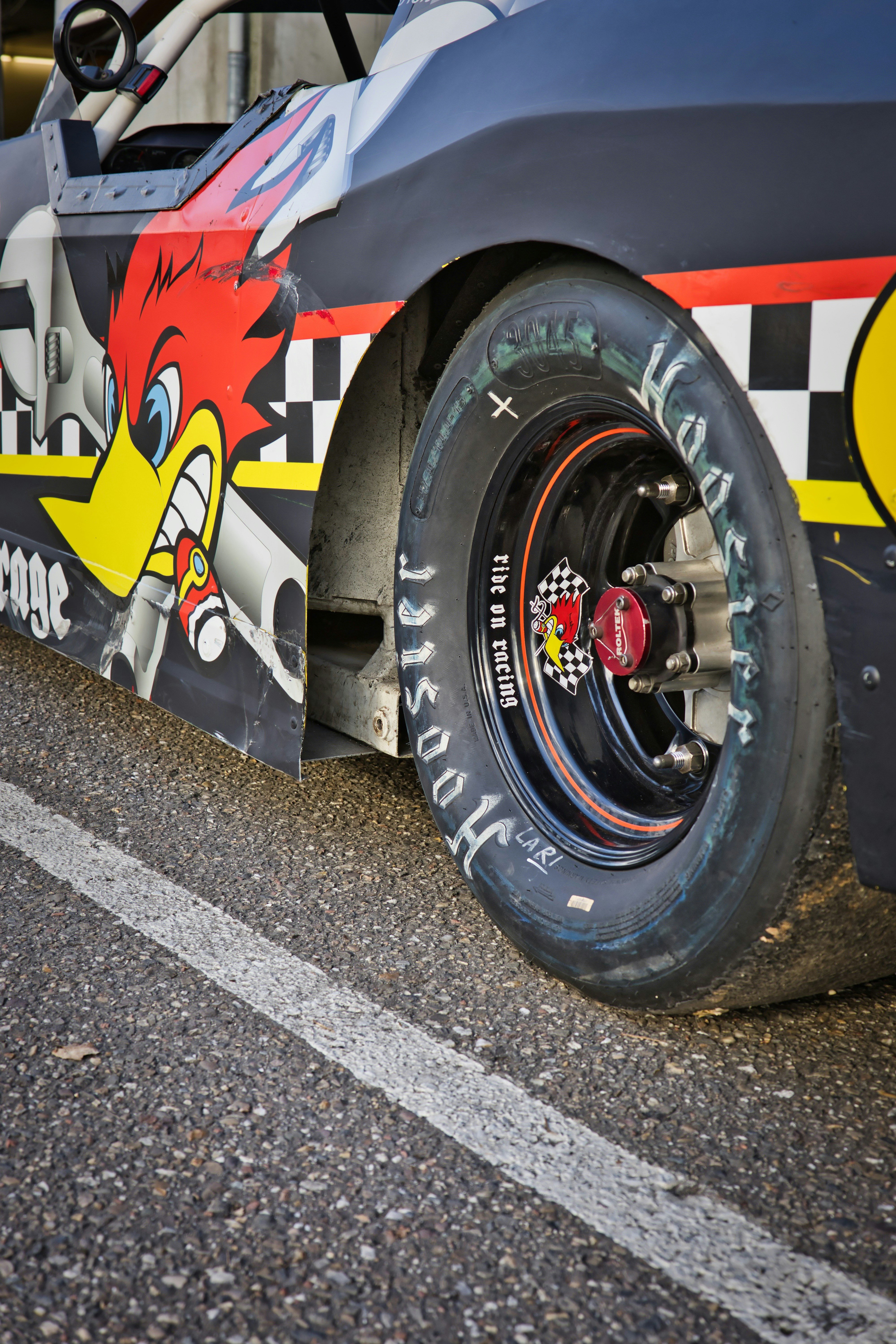 A race car displays woodpecker art and hoosier tire. photo – Free Car ...
