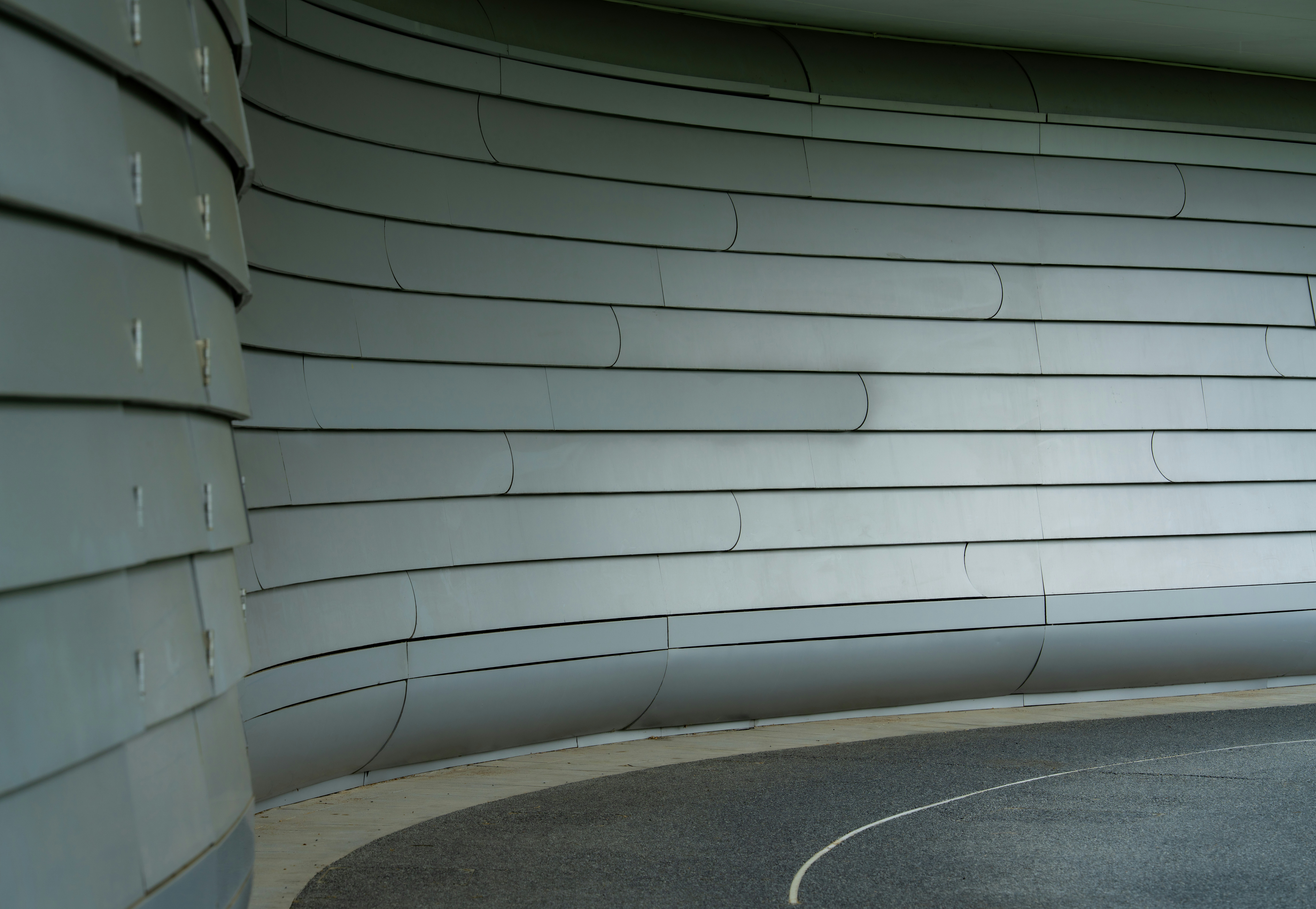 Curved exterior walls of buildings along the street