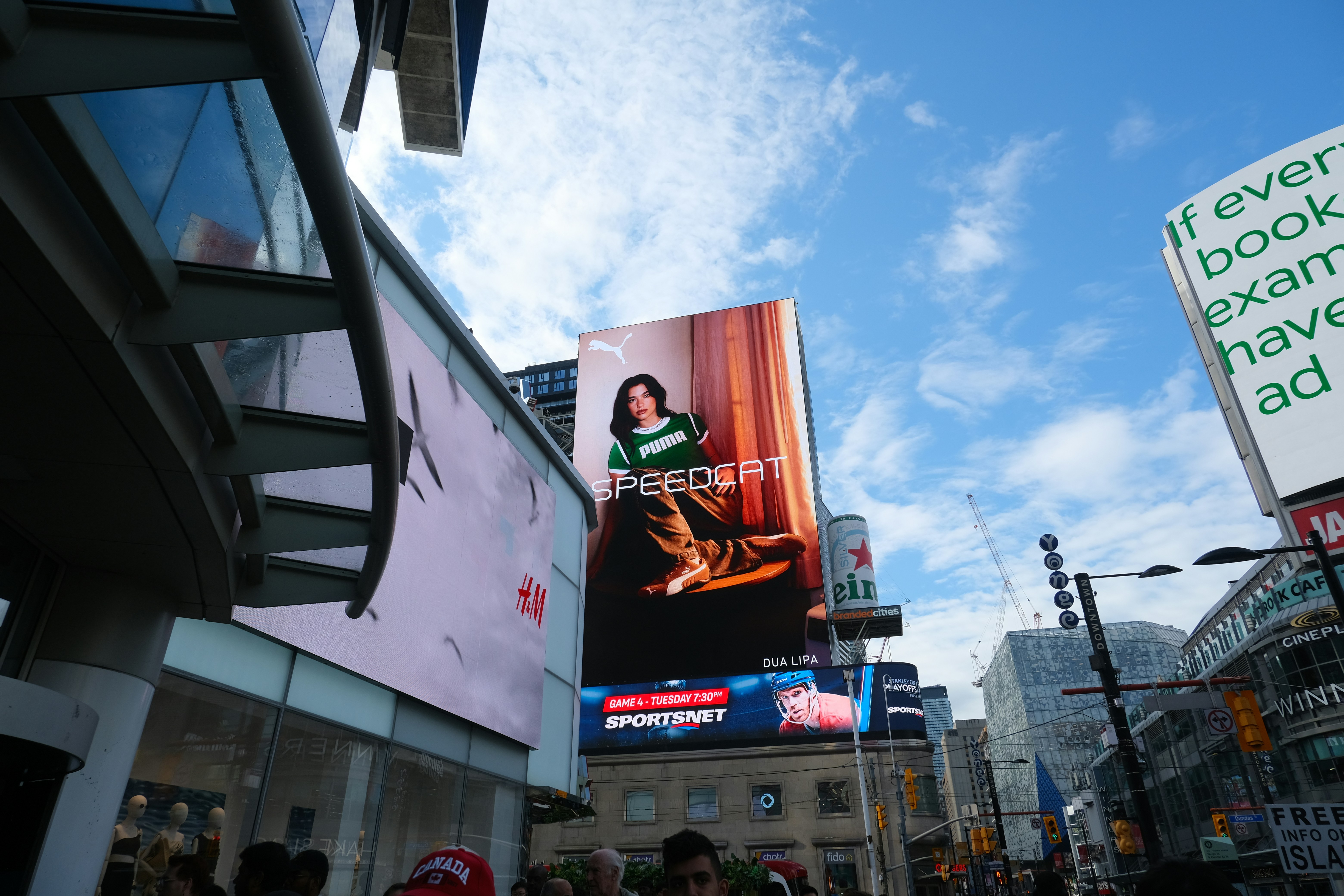 A large advertisement is displayed on a building. photo – Free Toronto ...