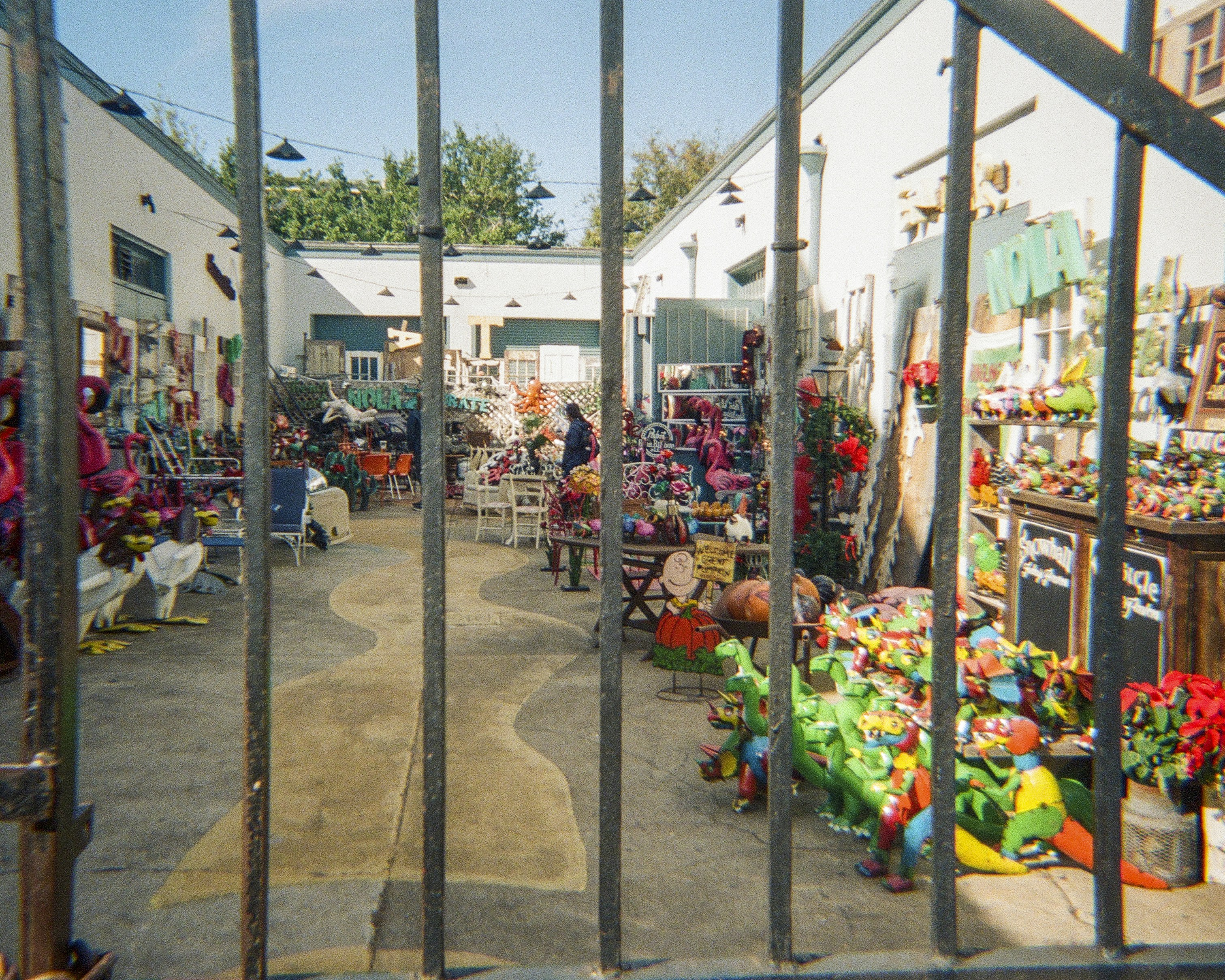 Shops and displays sit inside a gated area. photo – Free Outdoor Image ...