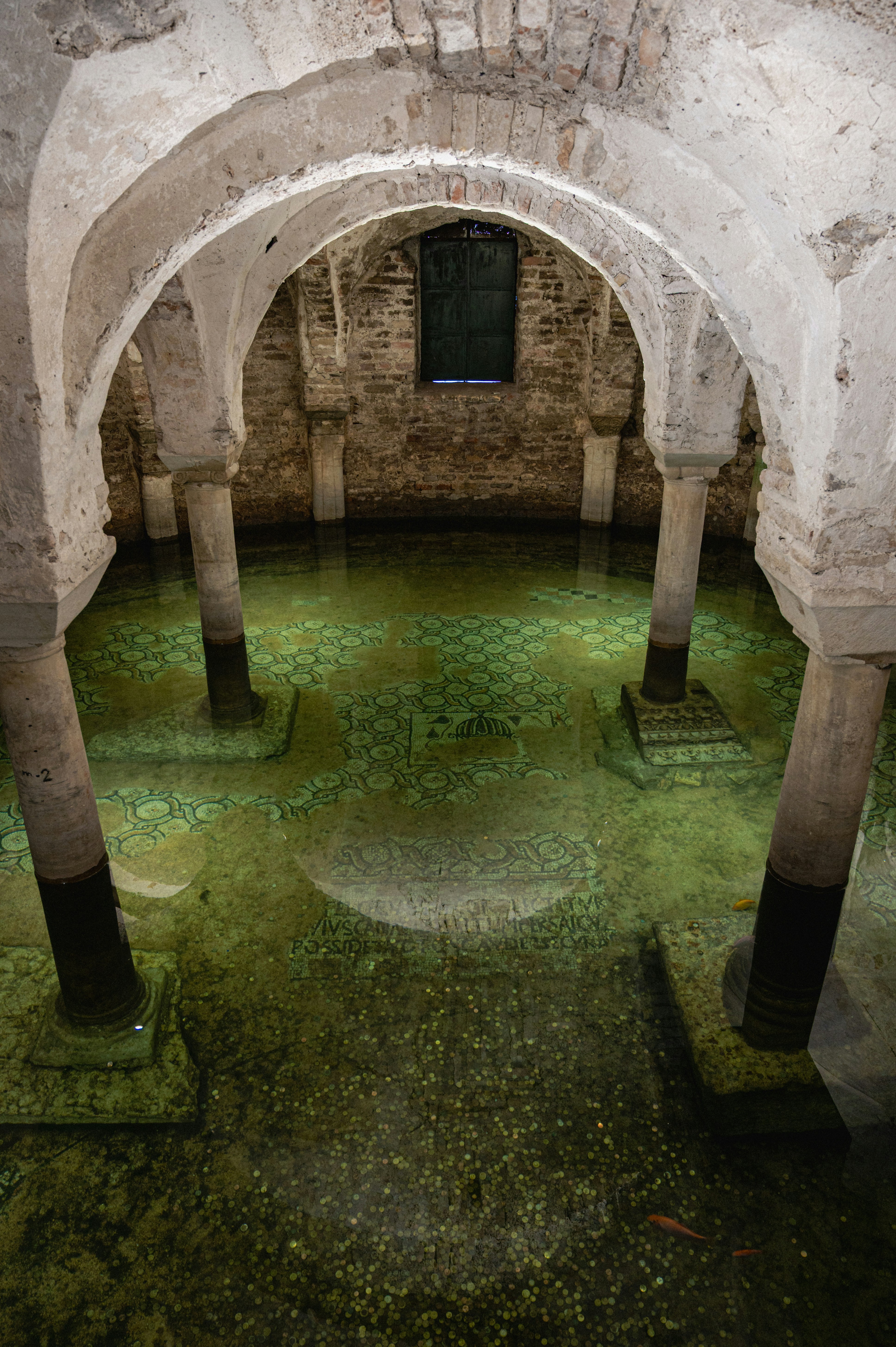 An ancient roman crypt with water filling the floor. photo – Free Floor ...