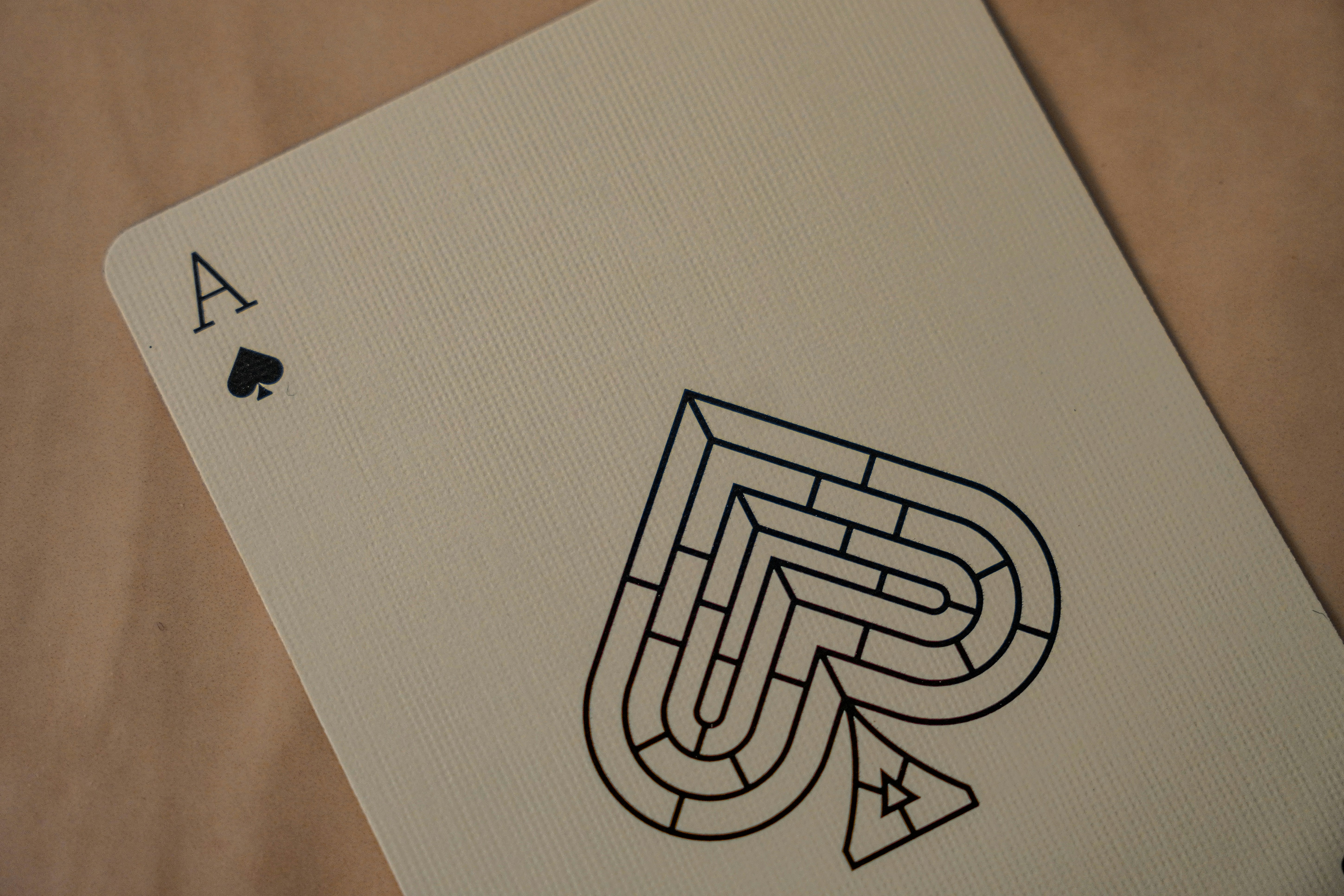 Ace of spades playing card with geometric maze-style design